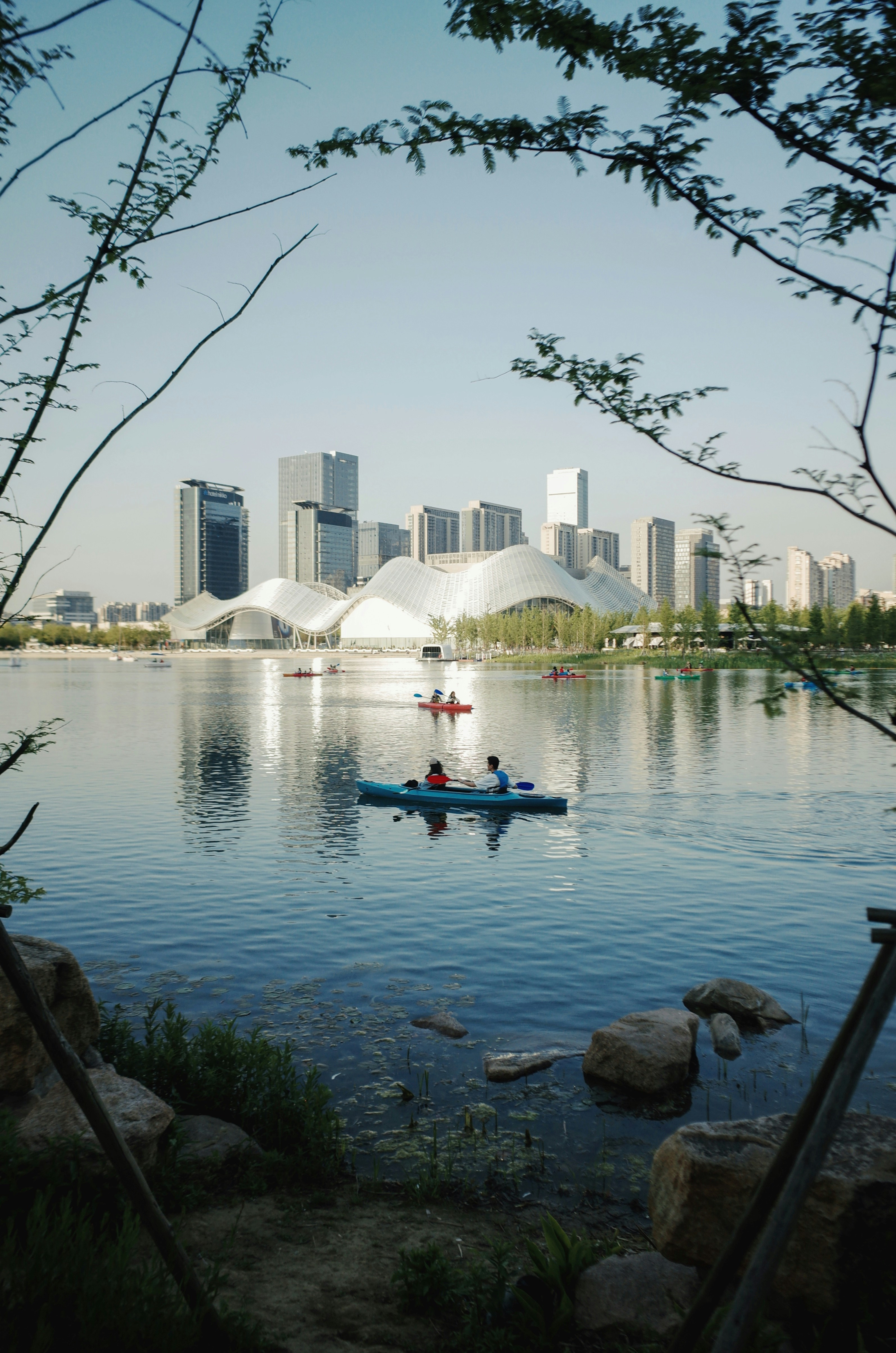 Riverside Canopy: Boats, Urban Waveforms, and Modern Architecture