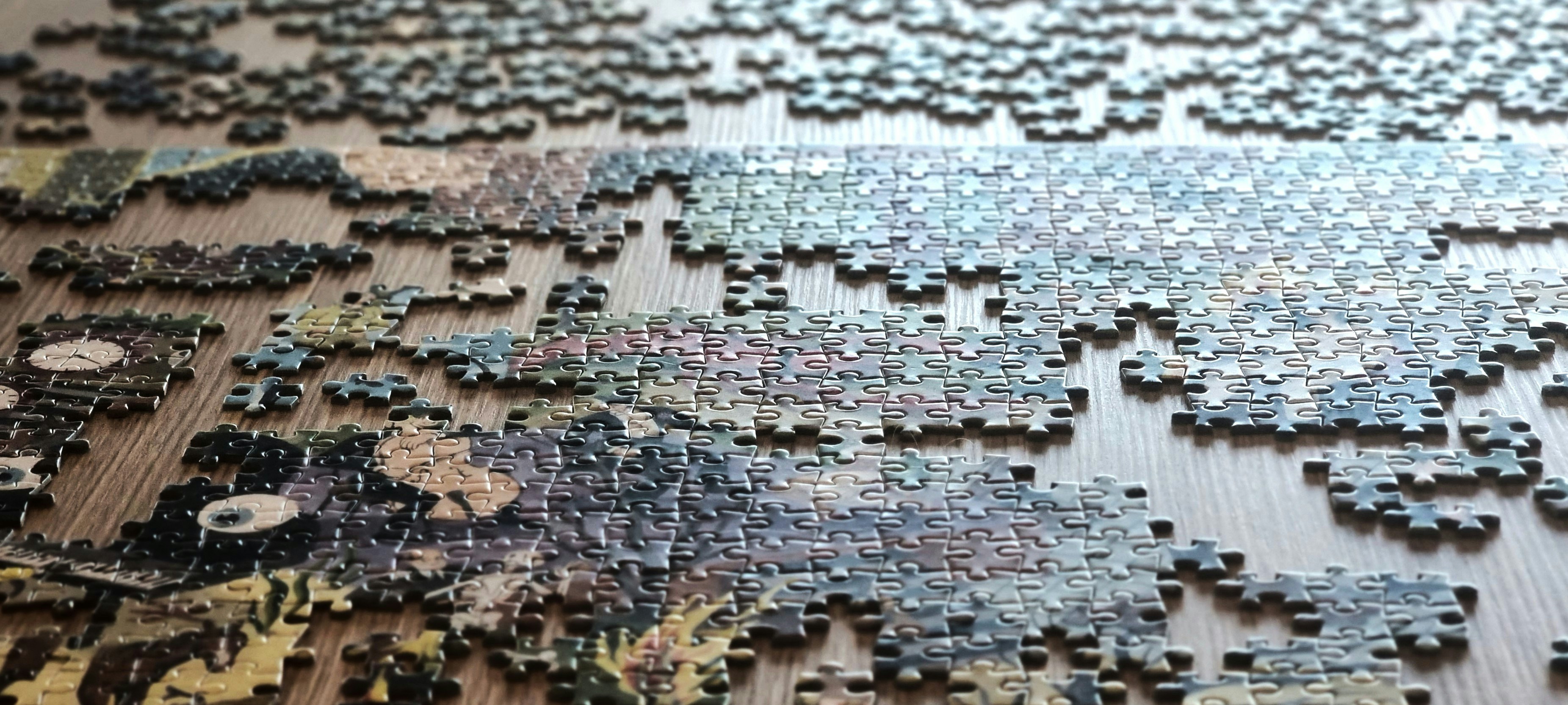Fragmented Byteboard: A Puzzle of Shattered Tiles and Warm Wood Grain