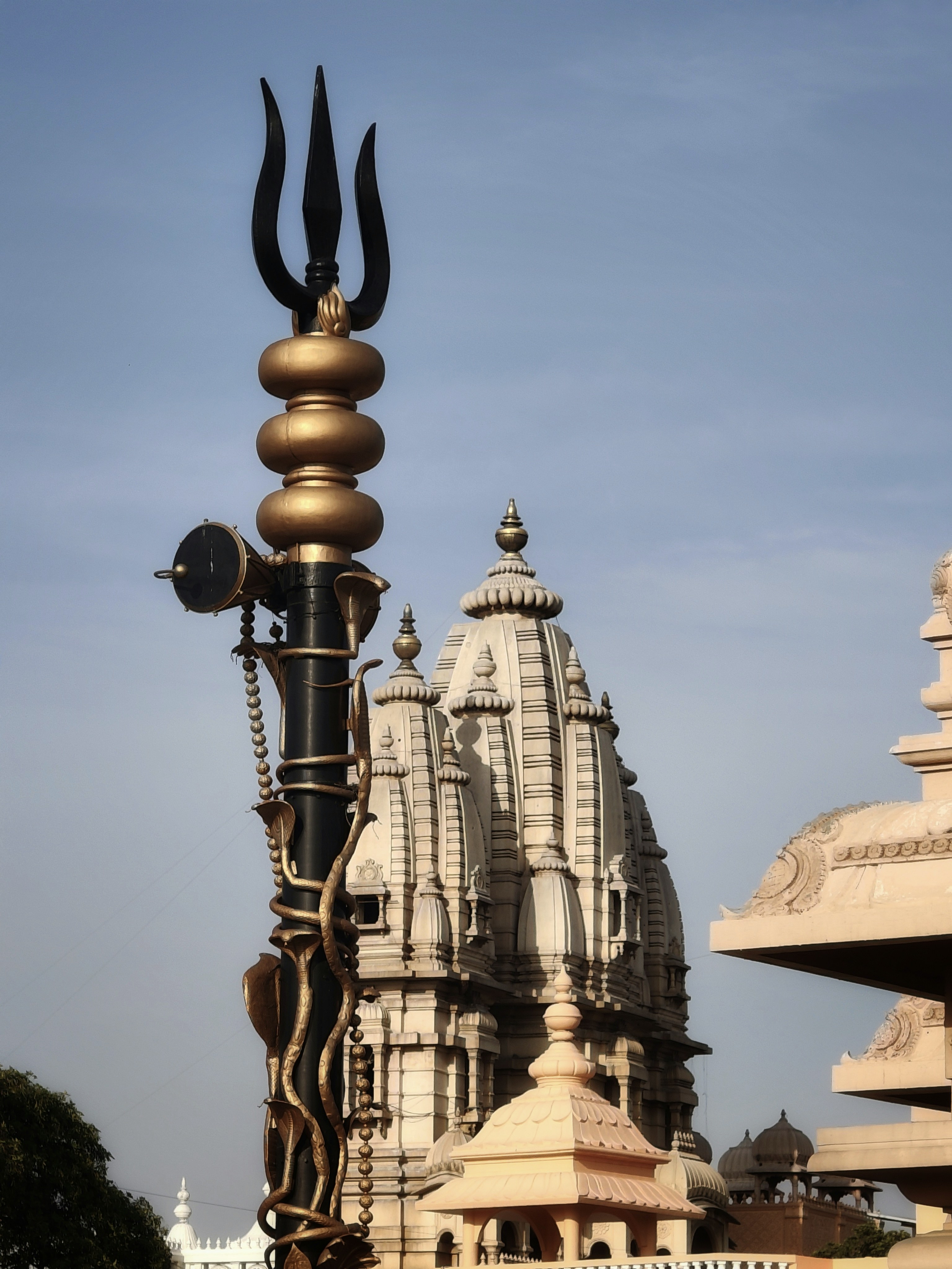 Trident Spire and Temple Fragments under a Clear Sky
