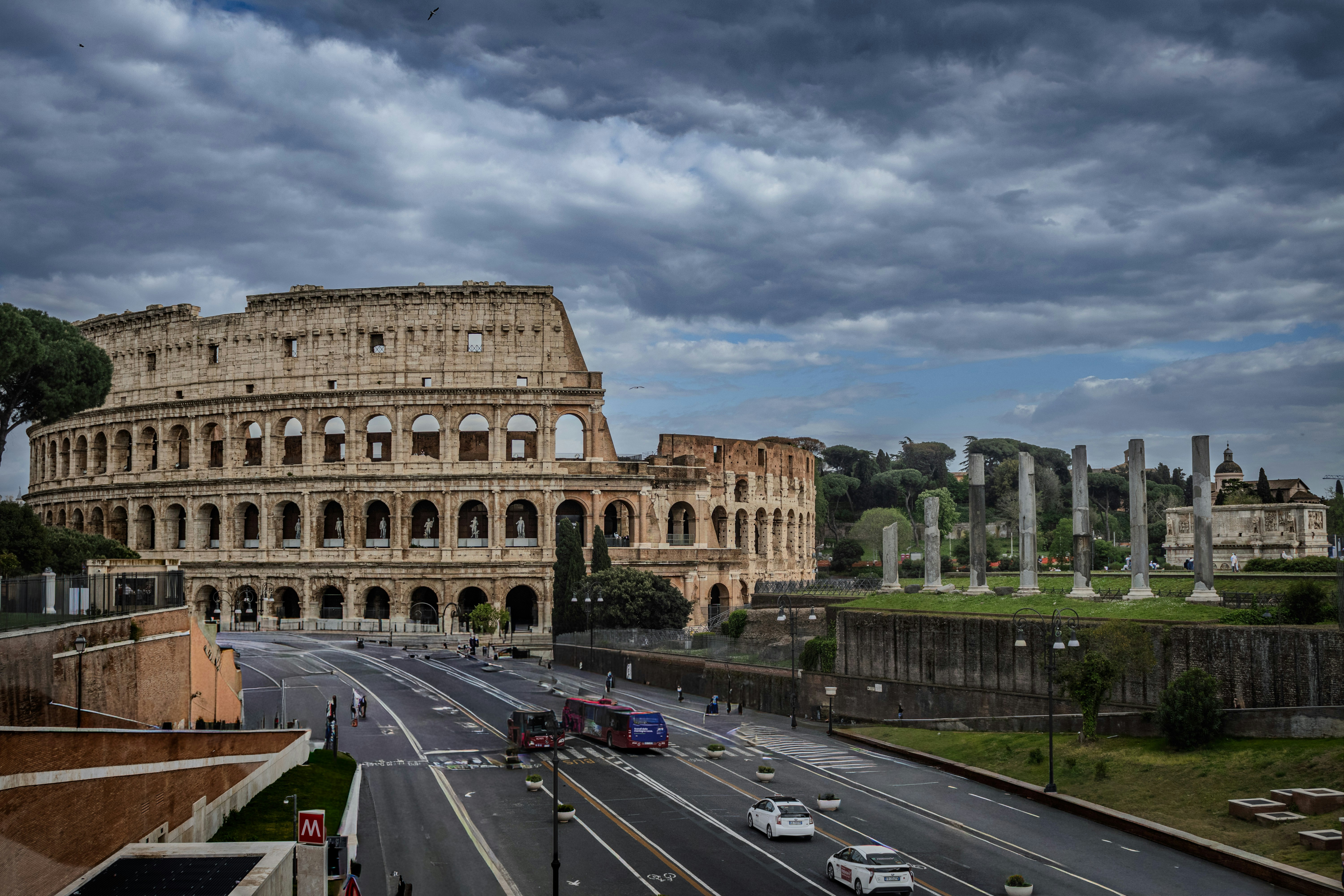 Rome’s Colosseum Emerges Over Modern Traffic