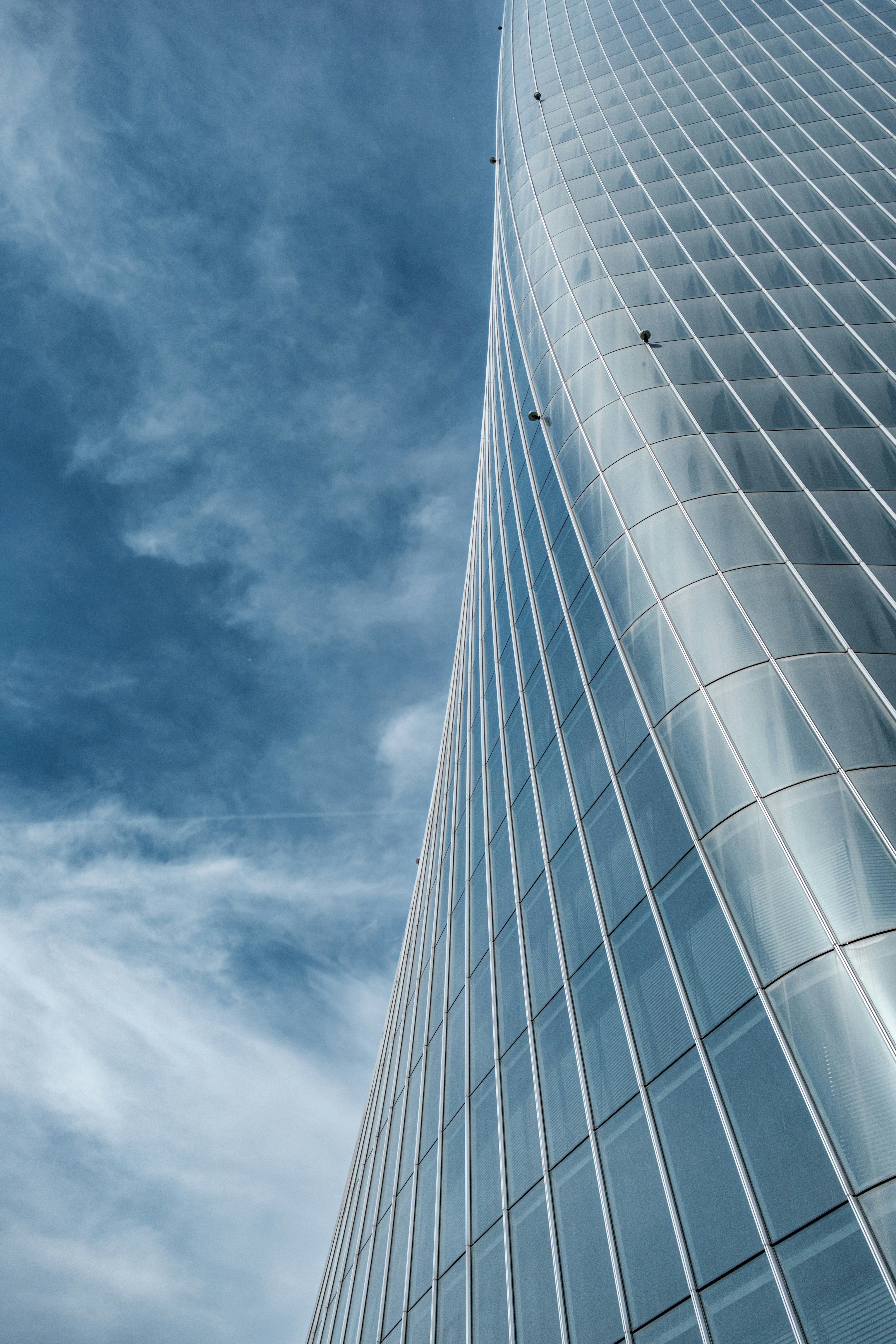 Skyward Facade: A Curtain of Glass Rises