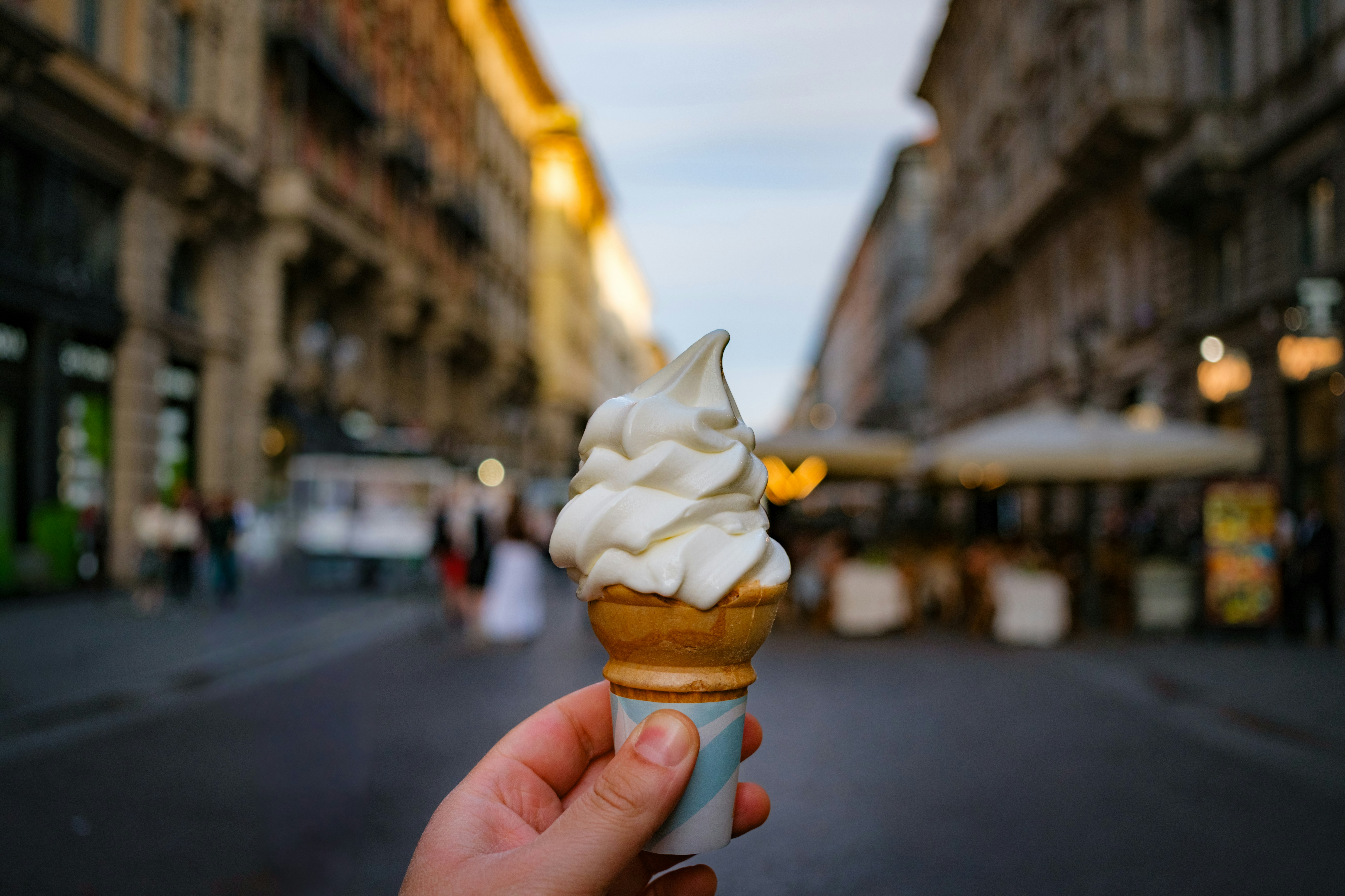 Cityscape Cone: Vanilla Swirl Against the Pedestrian Arc