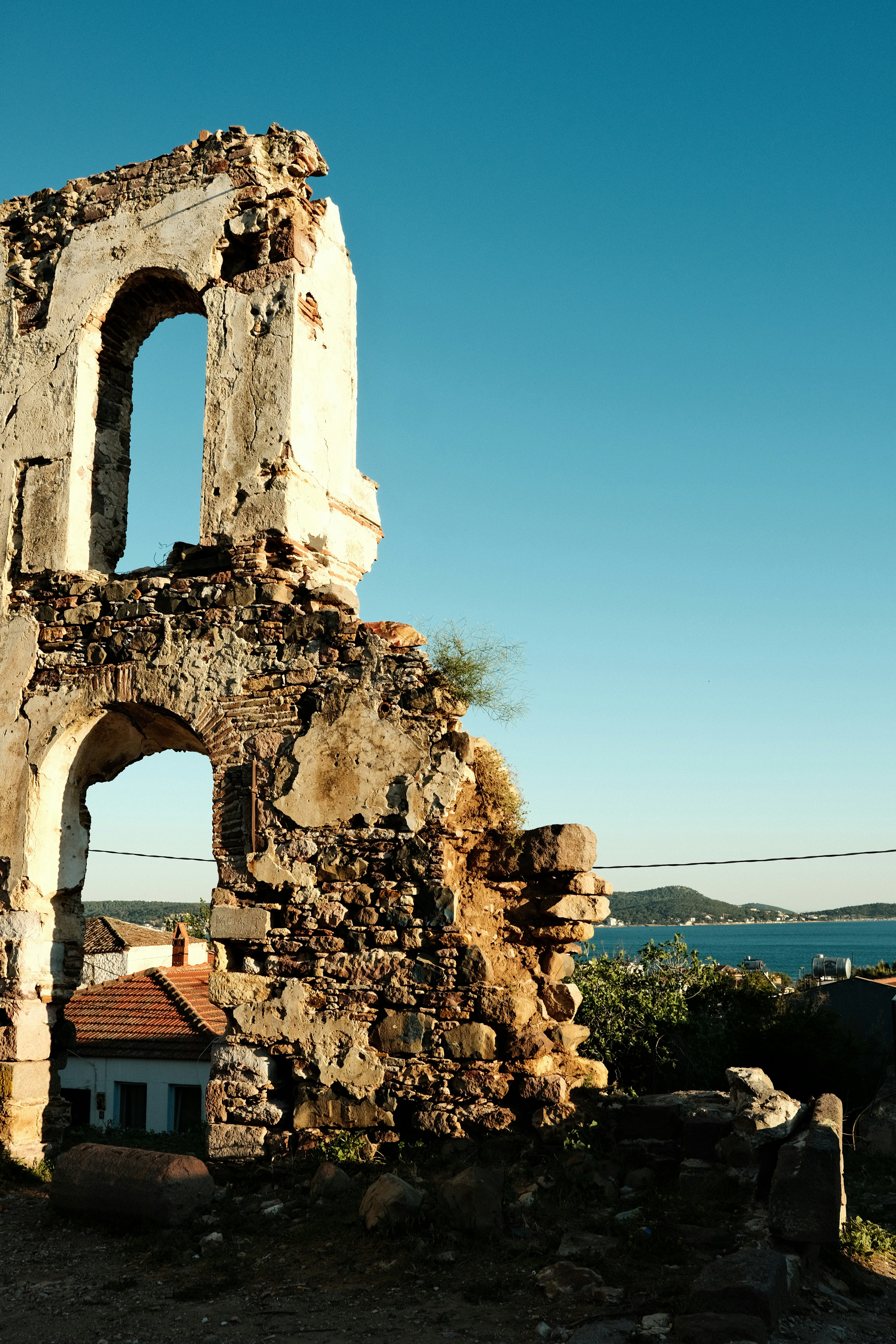 Ruin on the Ridge: Sunlit Arch Overlooking the Sea