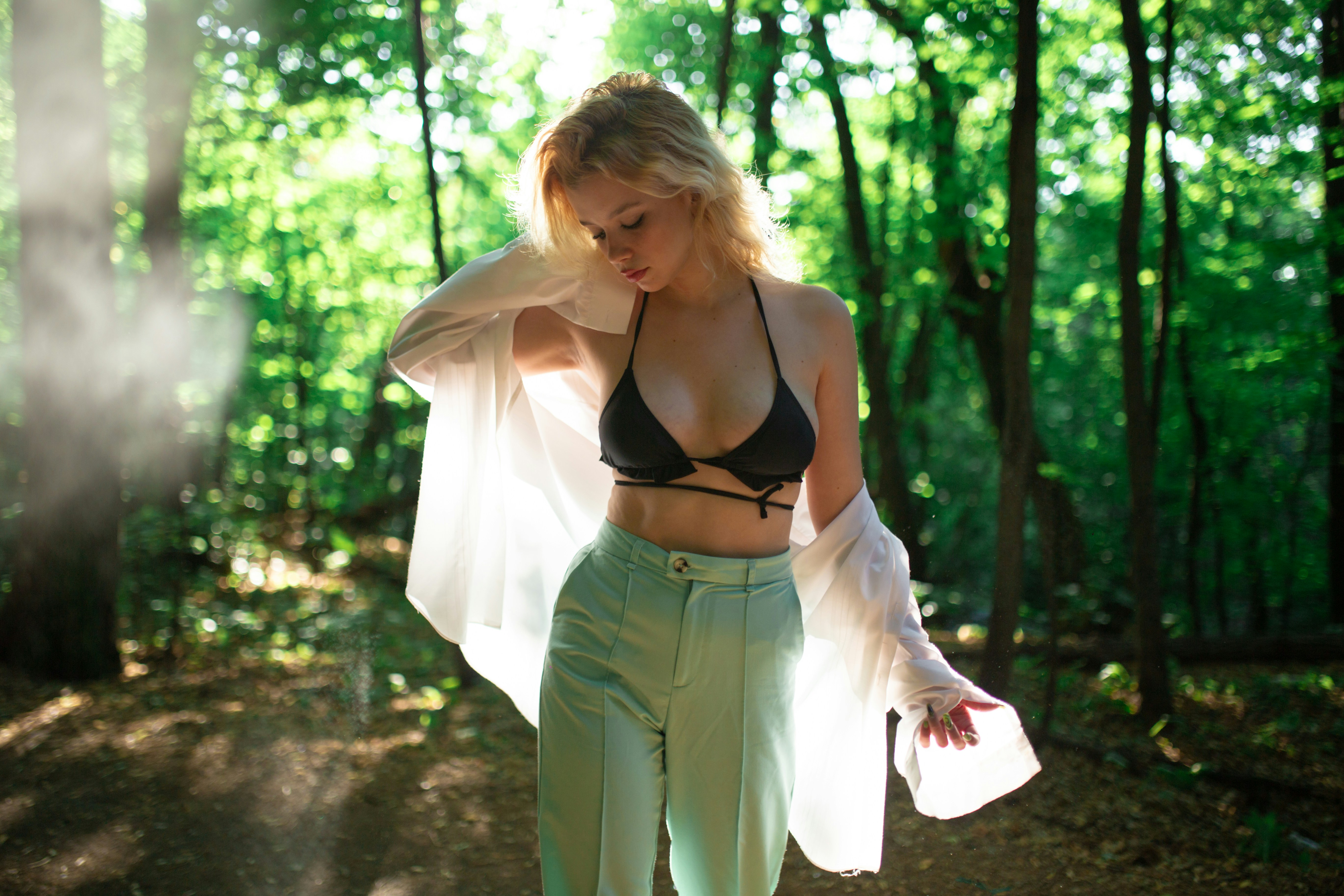 Sunlit Breeze: A Confident Pose in the Forest Clearing