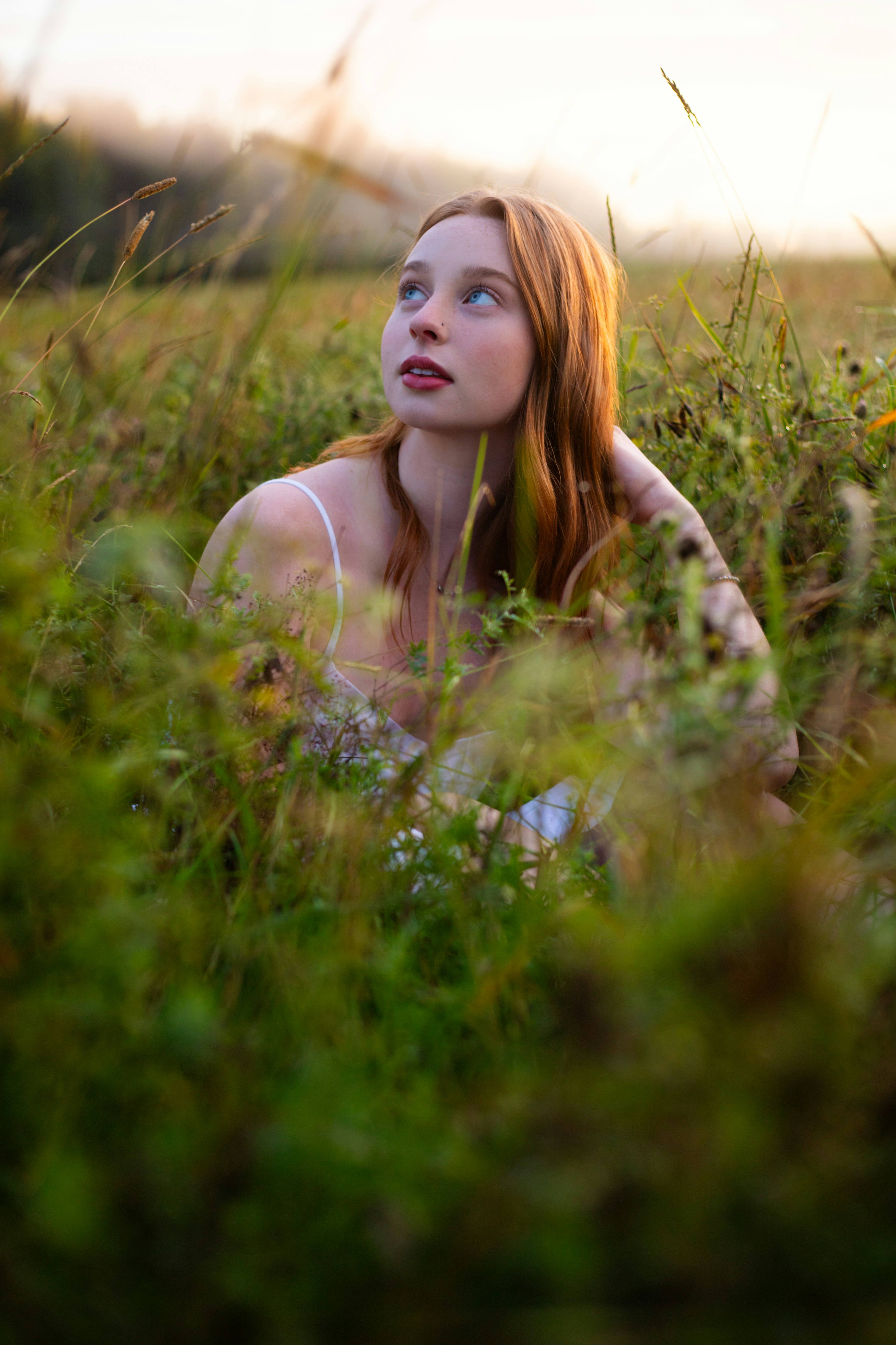 Soft-Golden Hour Reverie: A Quiet Portrait in Tall Grass