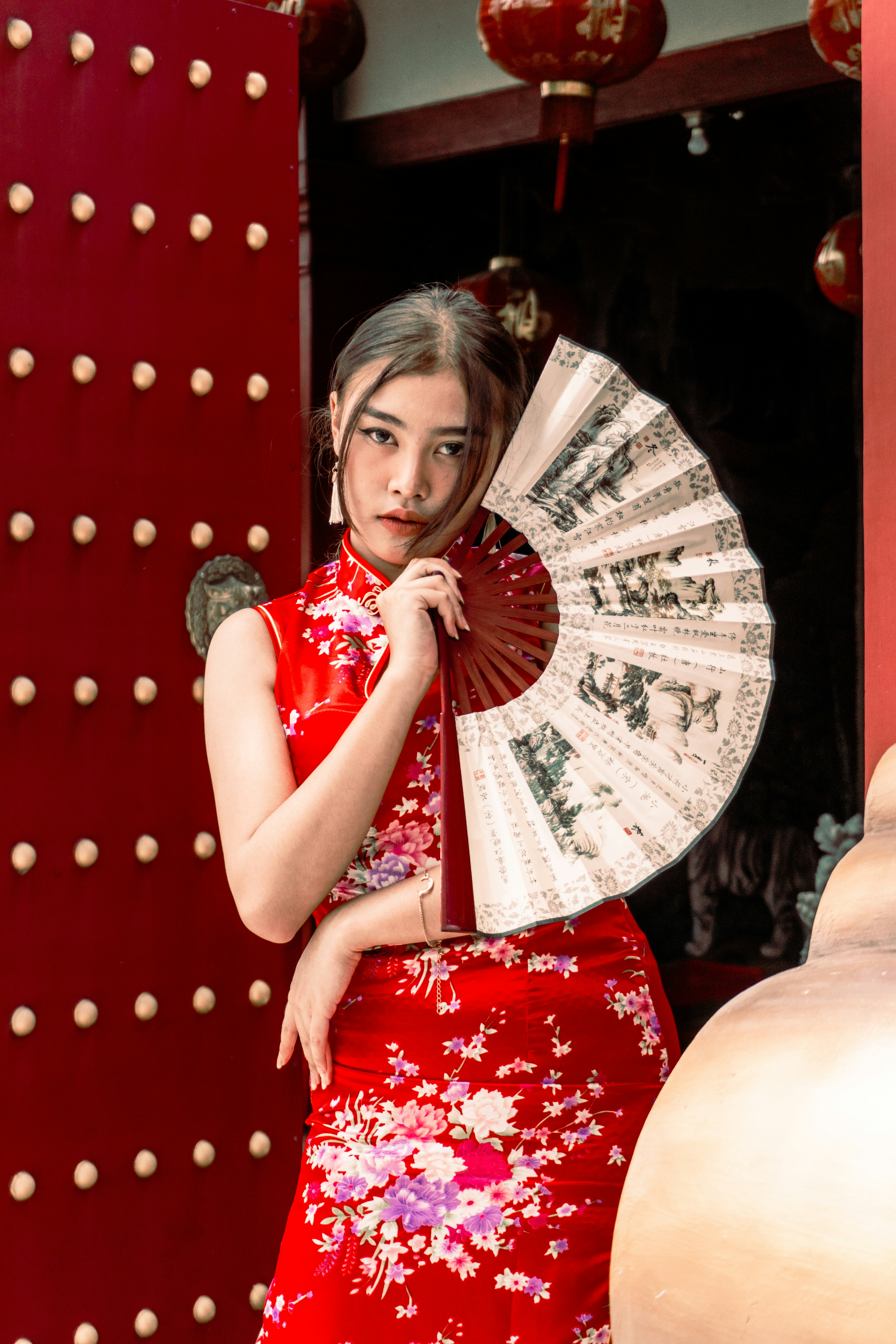 Crimson Cheongsam and Silent Fans