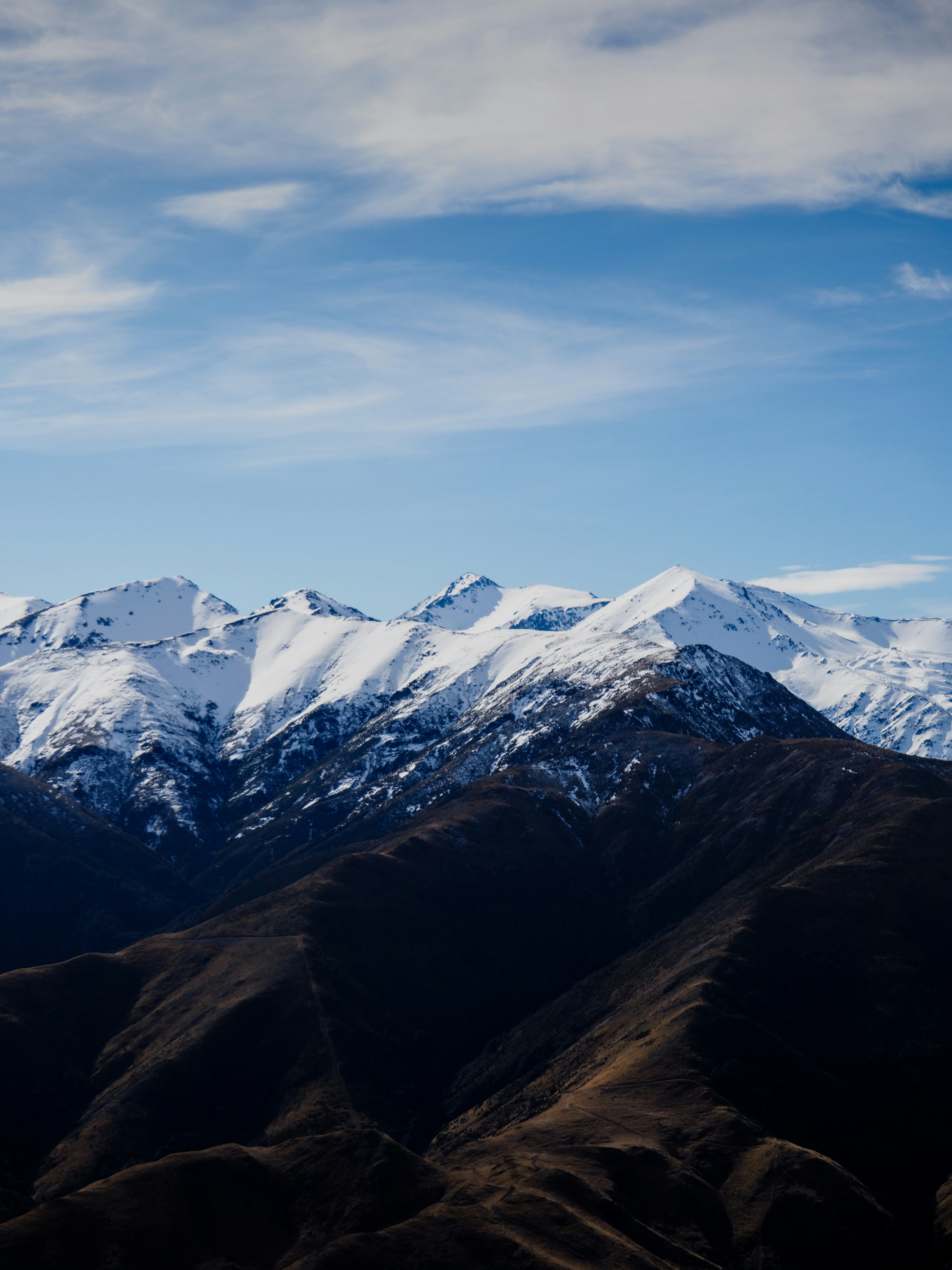 Snow-capped Ridge under a Vast Blue Sky