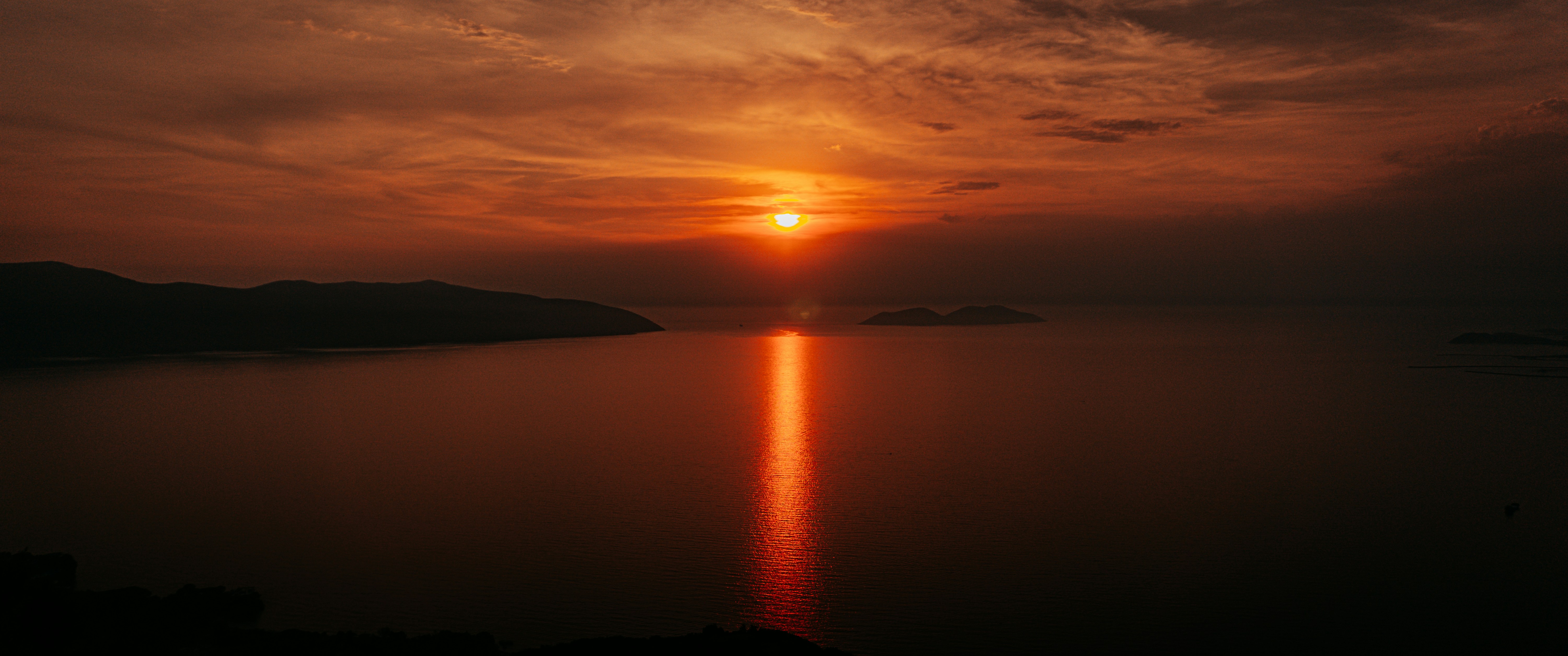 Dawning Over Quiet Waters: A Golden Path Across the Sea