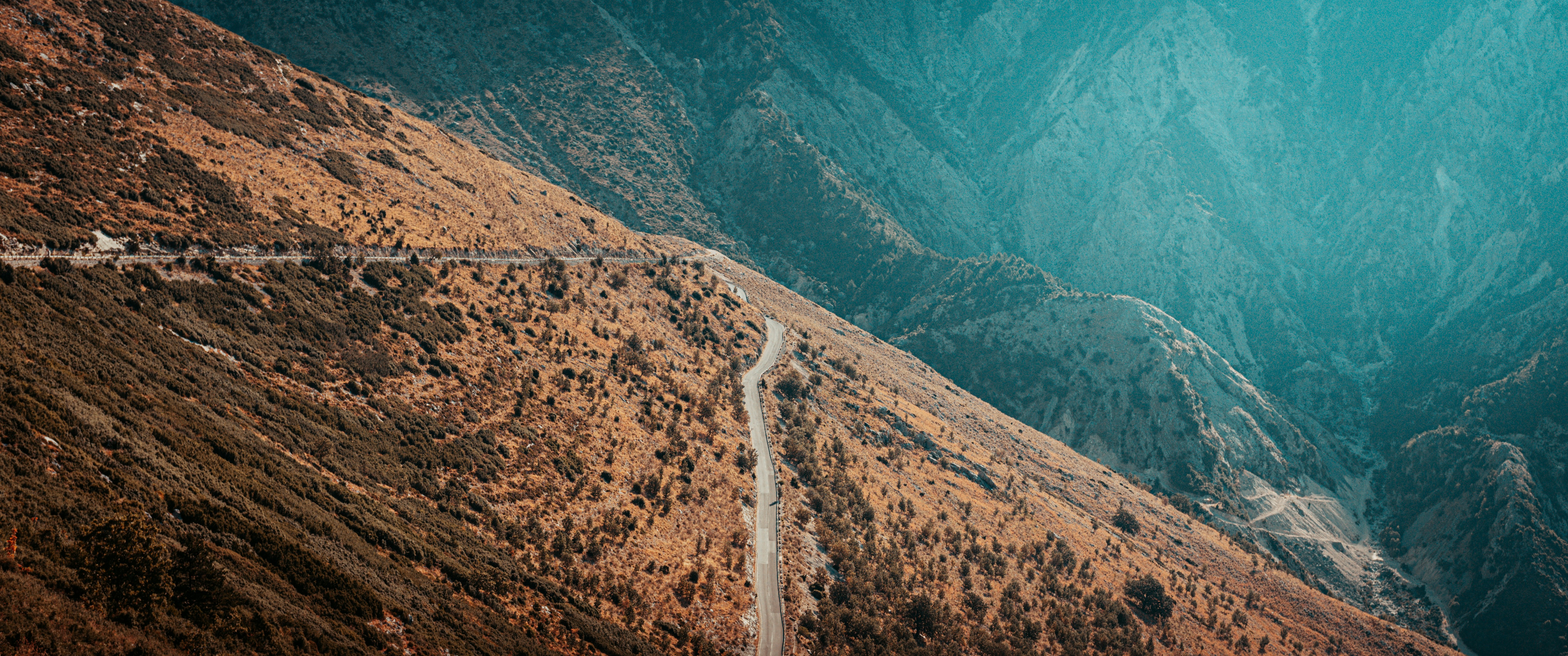 Coiled Road Through Alpine Quiet