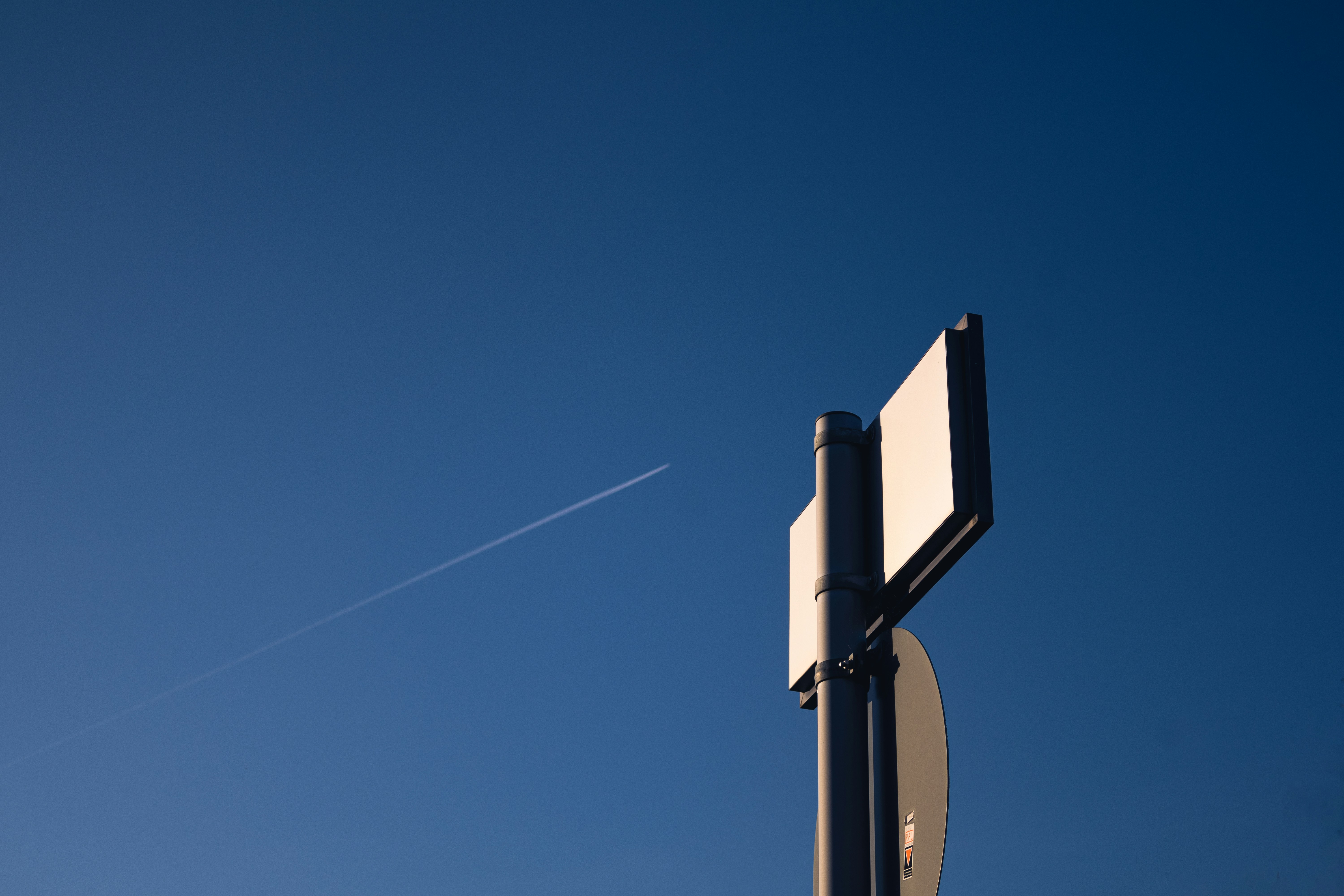 Vertical Signpost Against a Deep Blue Sky