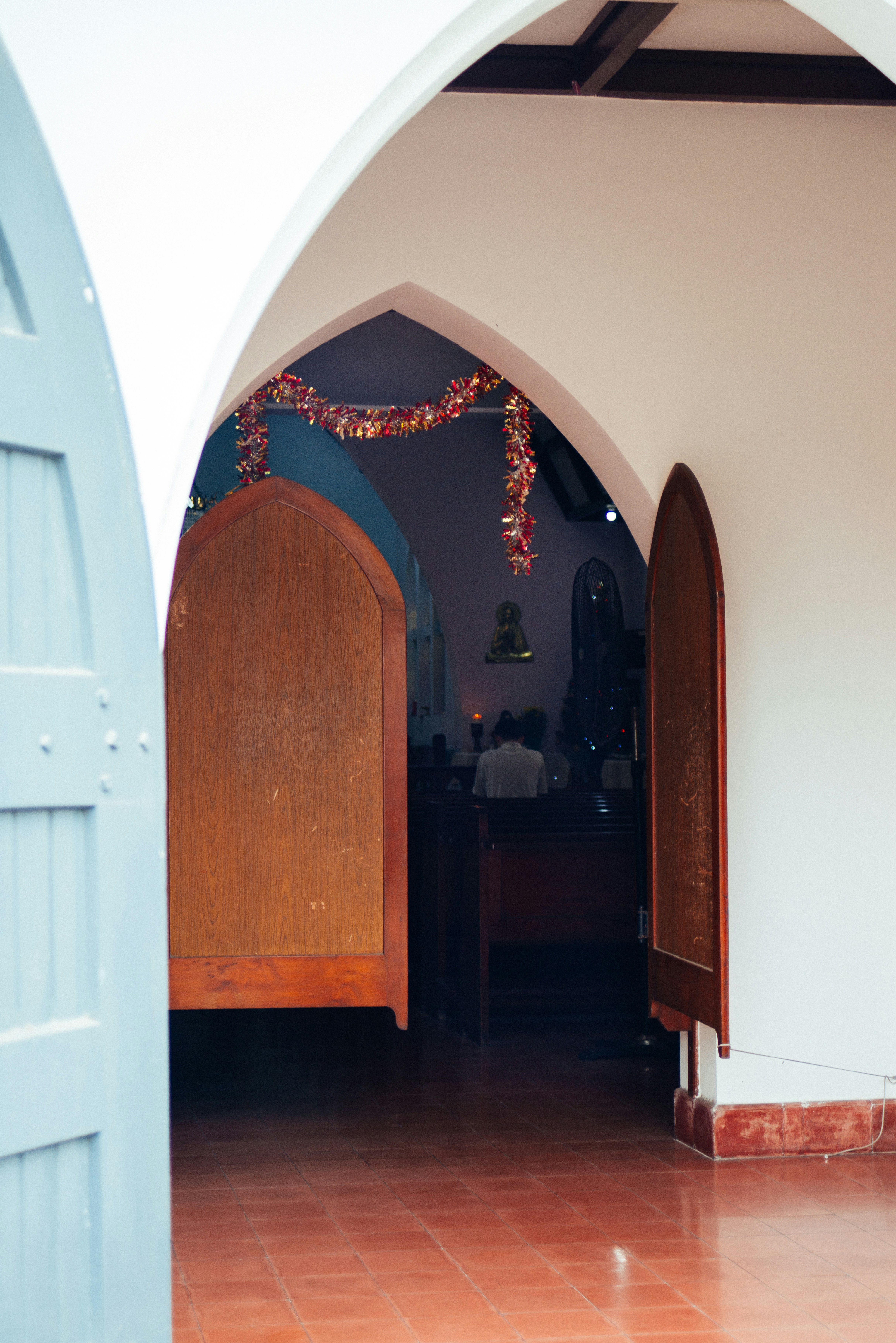 Open Archway into a Quiet Interior with Christmas Garland