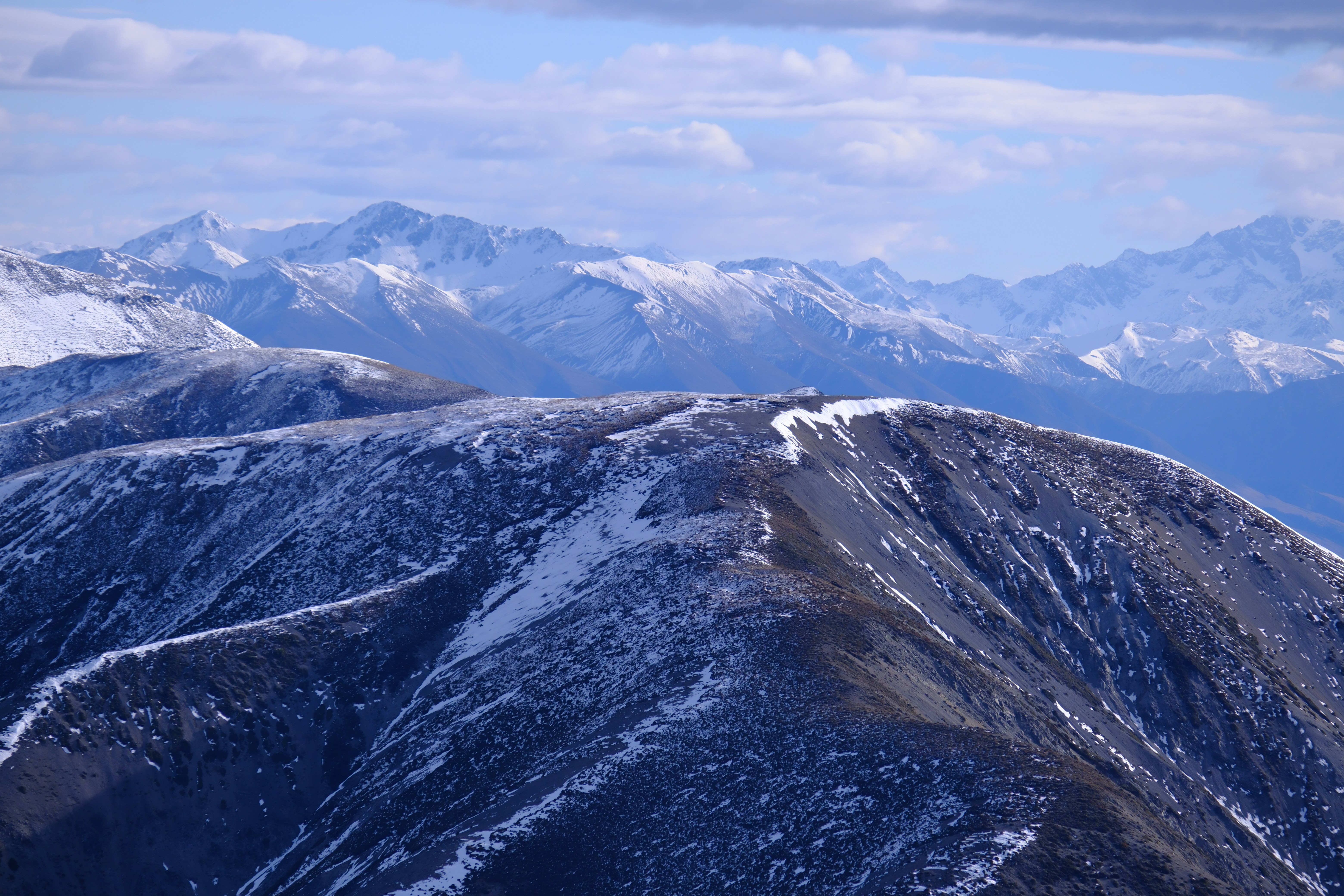Ridge Line Crossing the Snow-dusted Spine