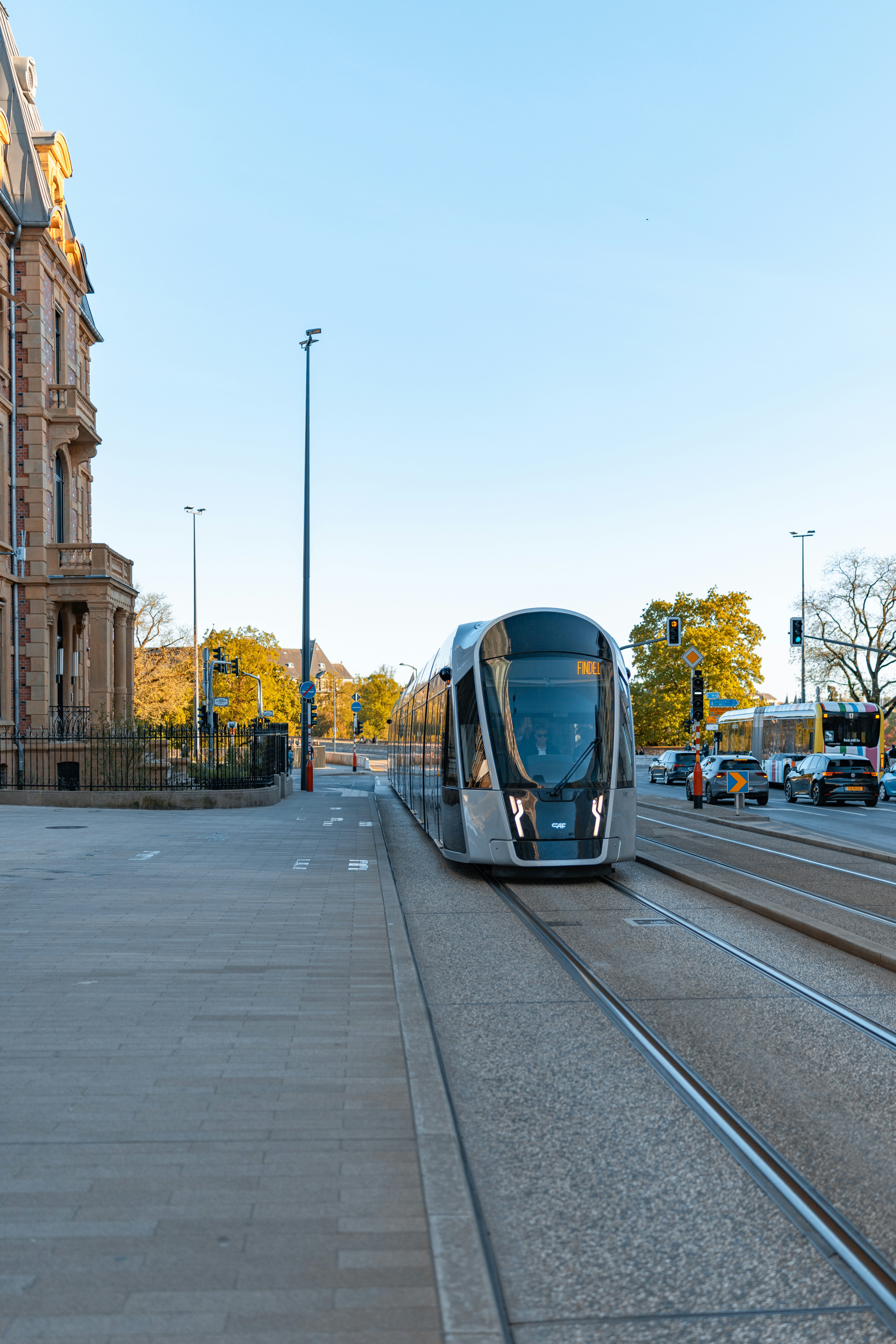 Tram in Transit: Modern Vehicle Gliding Along a City Street