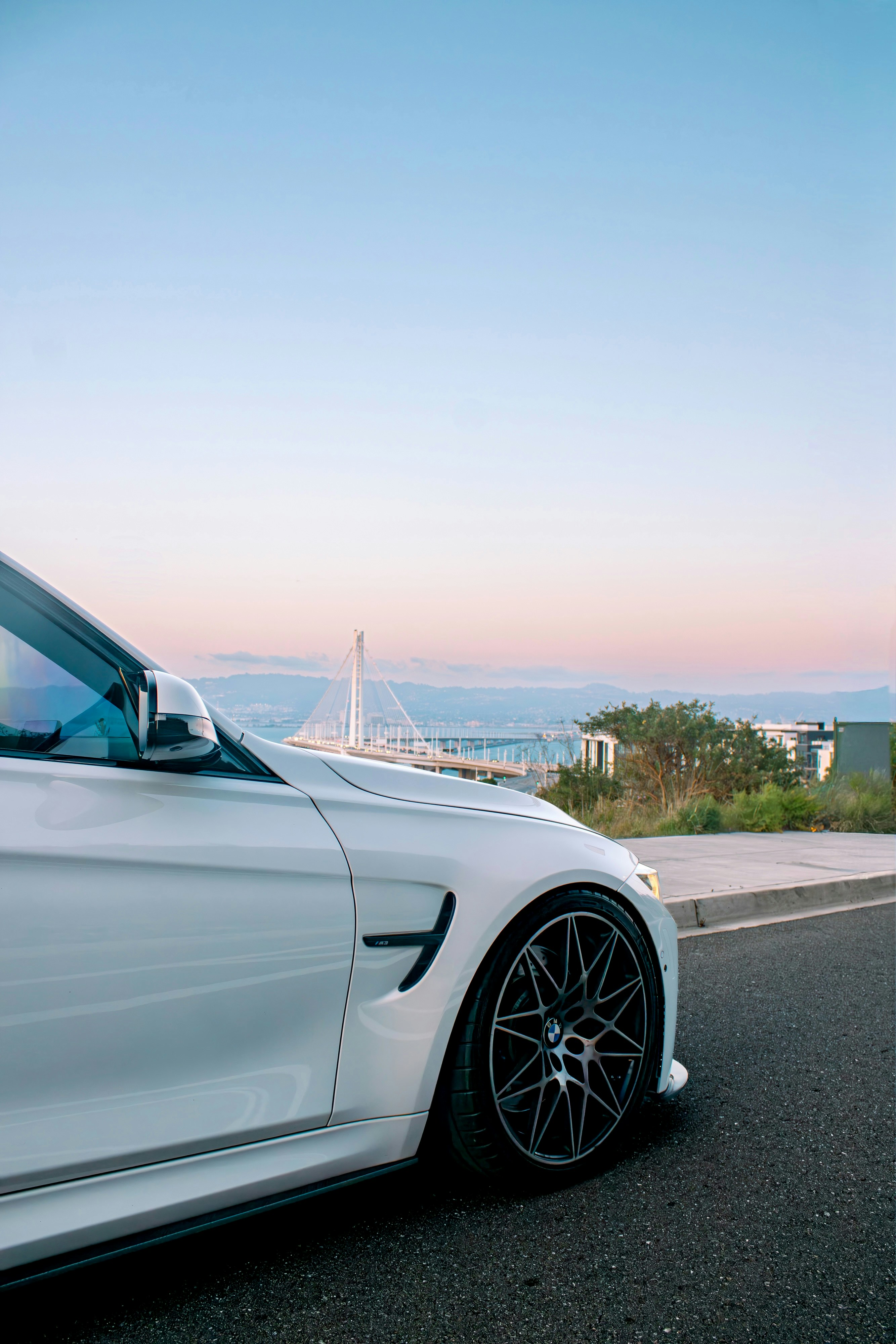 Low-Angle Dawn by the Waterfront: A White M-BMW at Rest