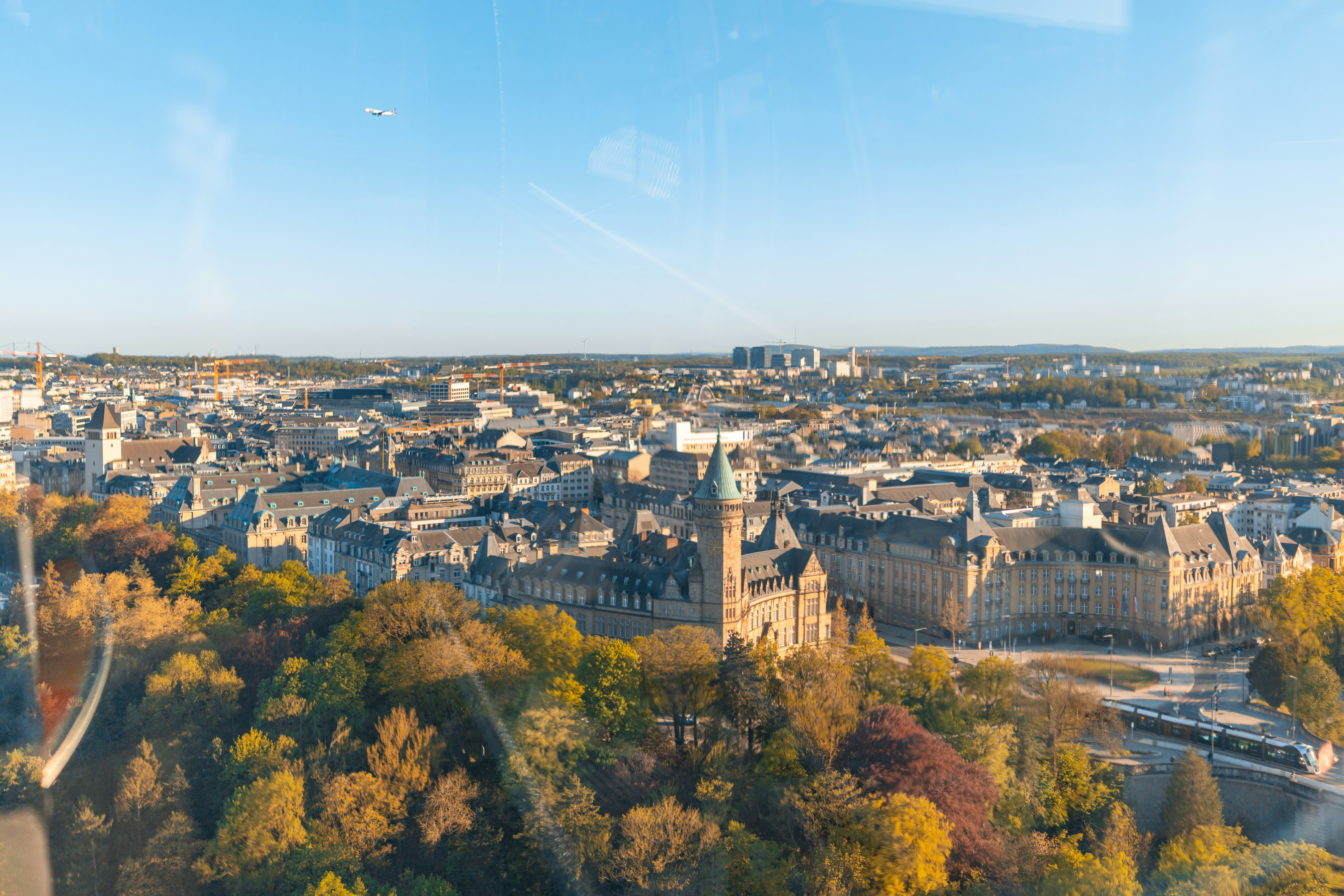 Colored autumn cityscape seen through a glassy overlook