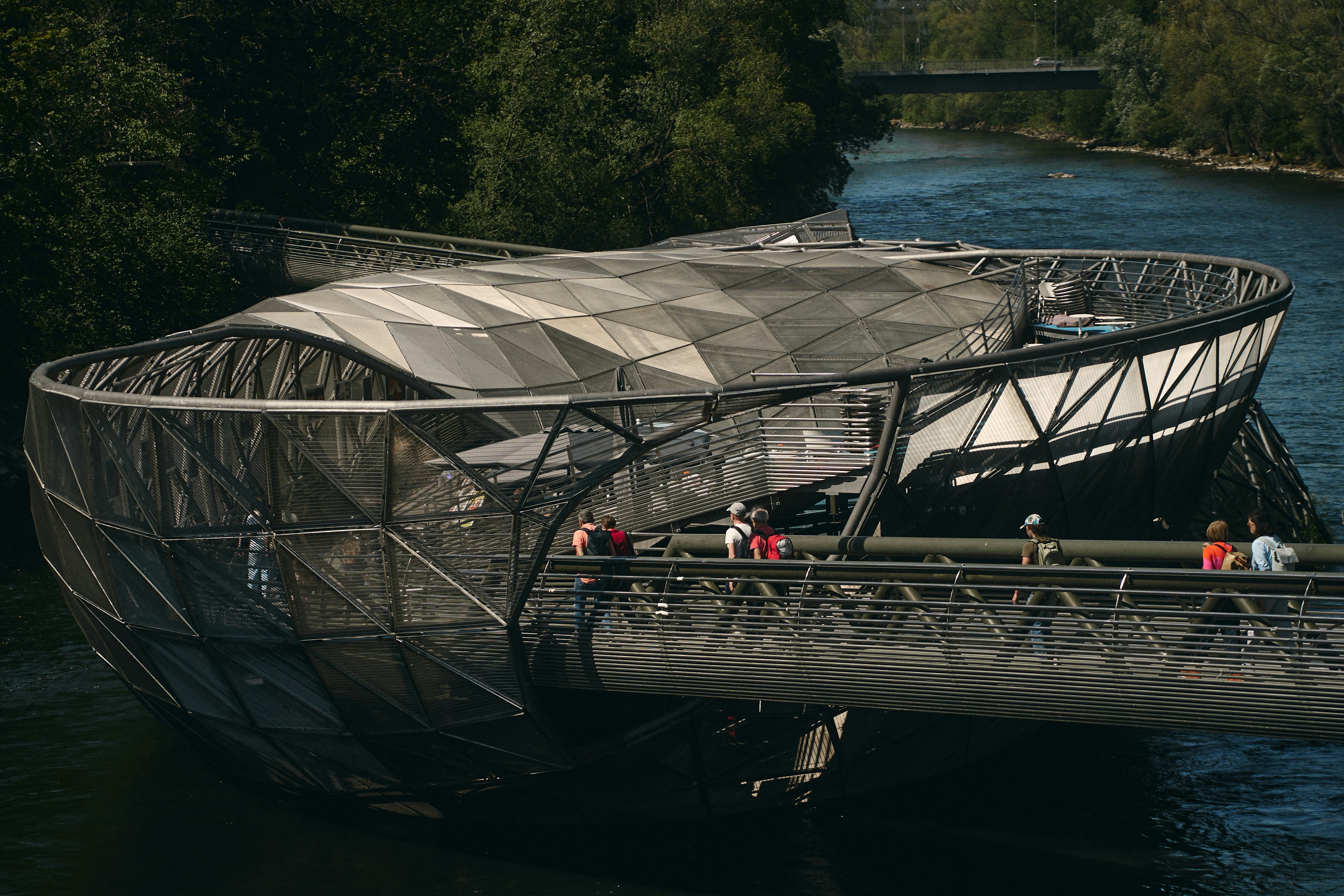 Curved Skywalk over the River: The Glass-Panel Pavilion