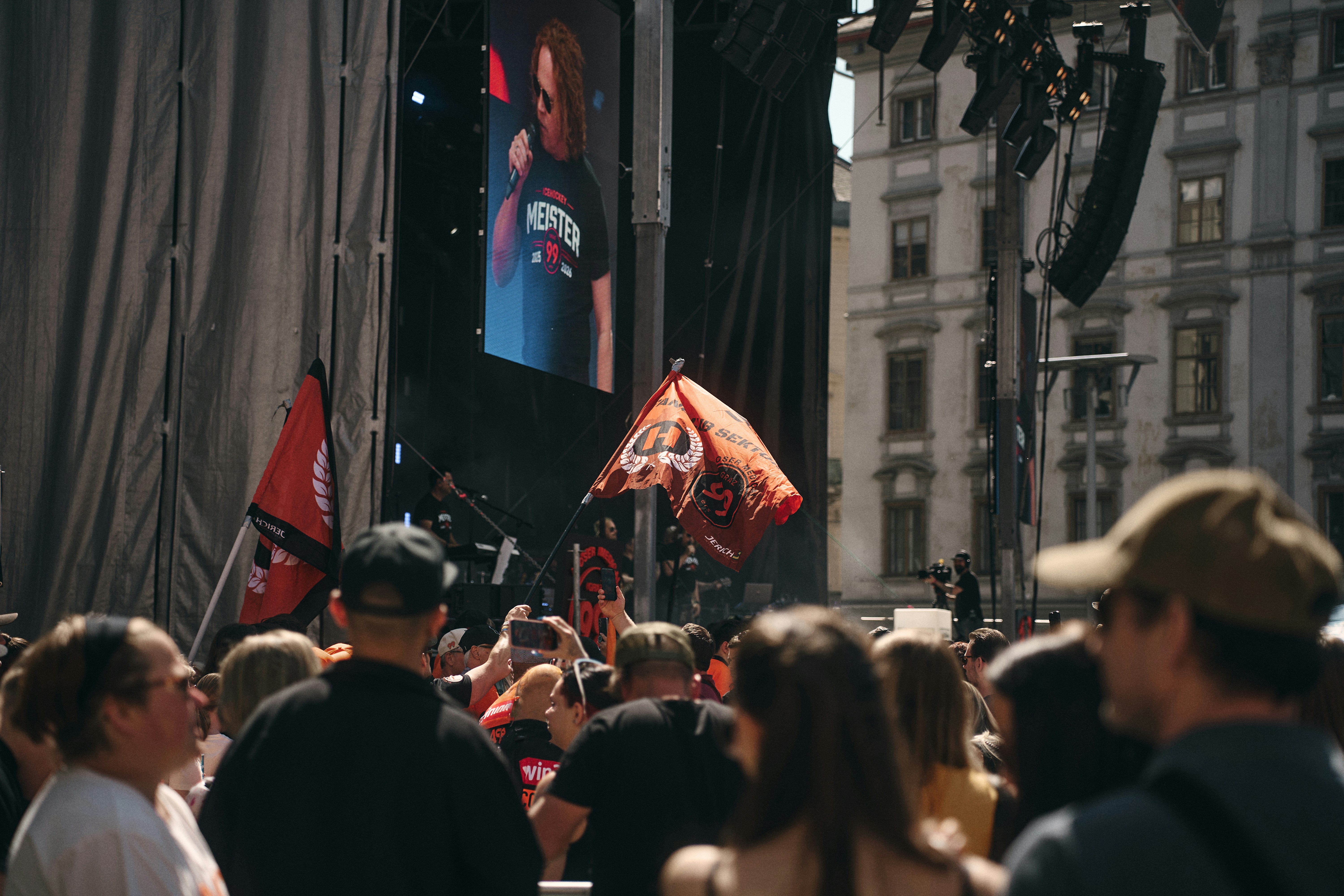 Midfield Anthem: A Crowd Gathers at a City Stage