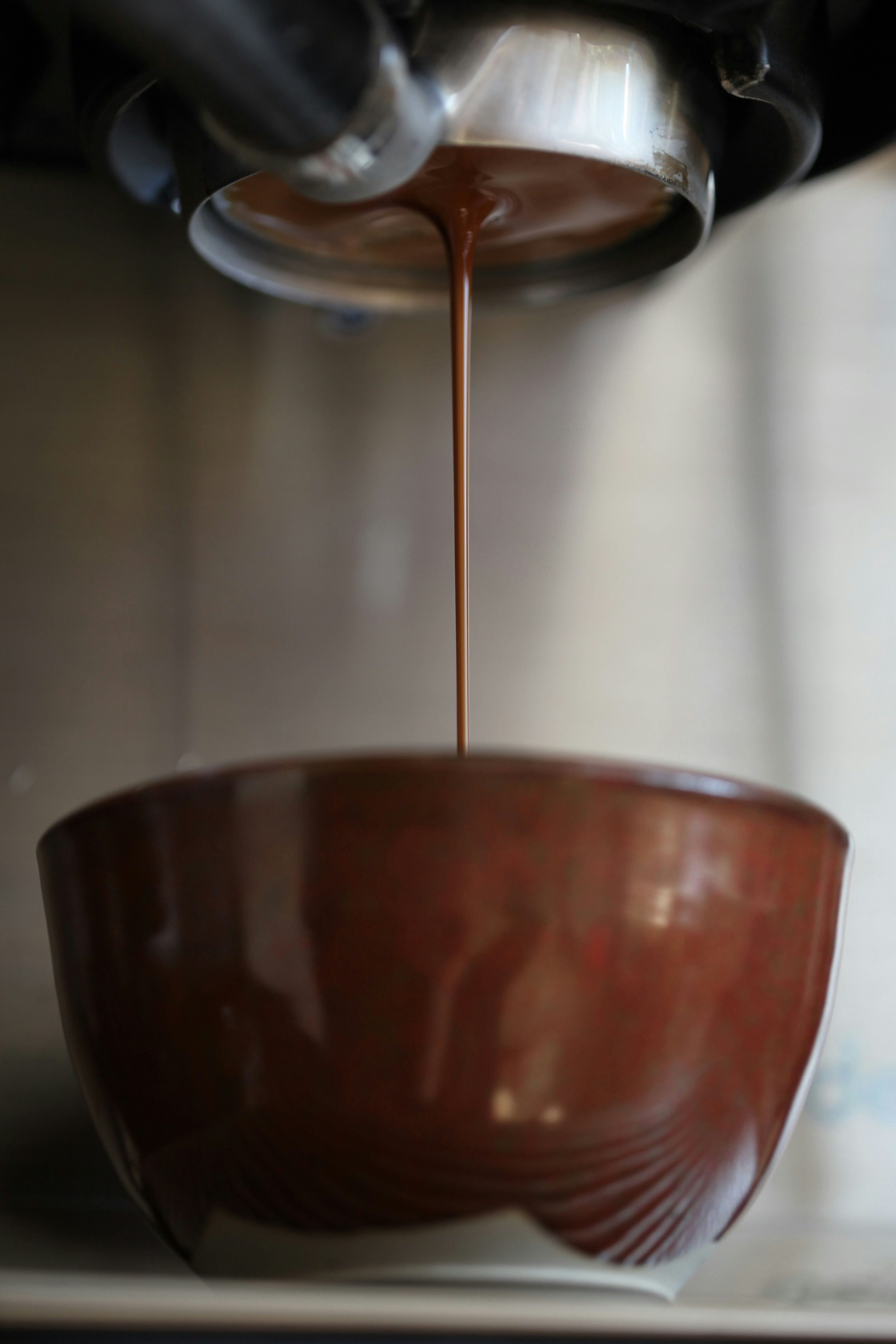 Liquid Gold: Espresso Streams into a Ceramic Cup