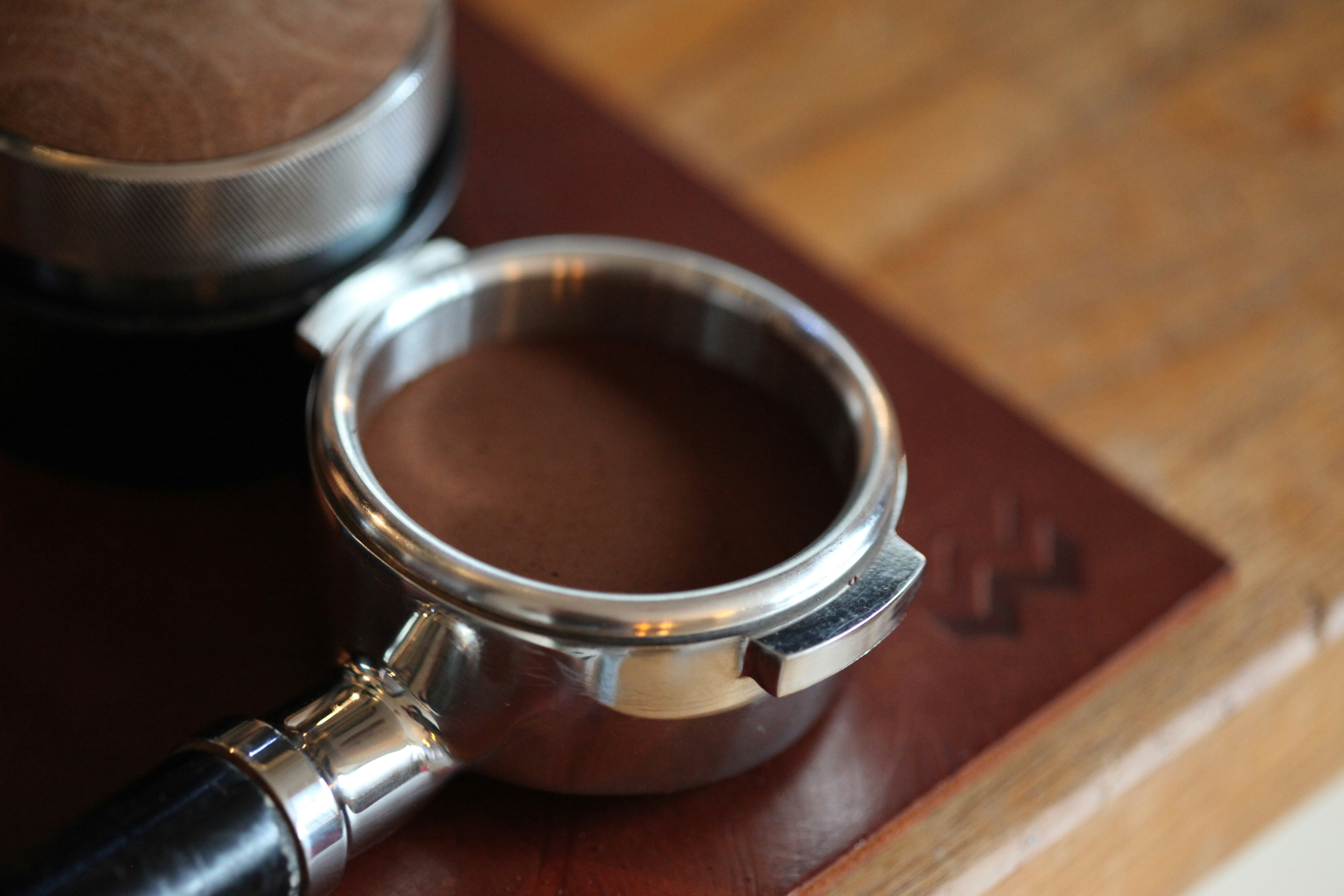 Coppery Light Through a Lens: A Magnifier Resting on a Rich Leather Surface