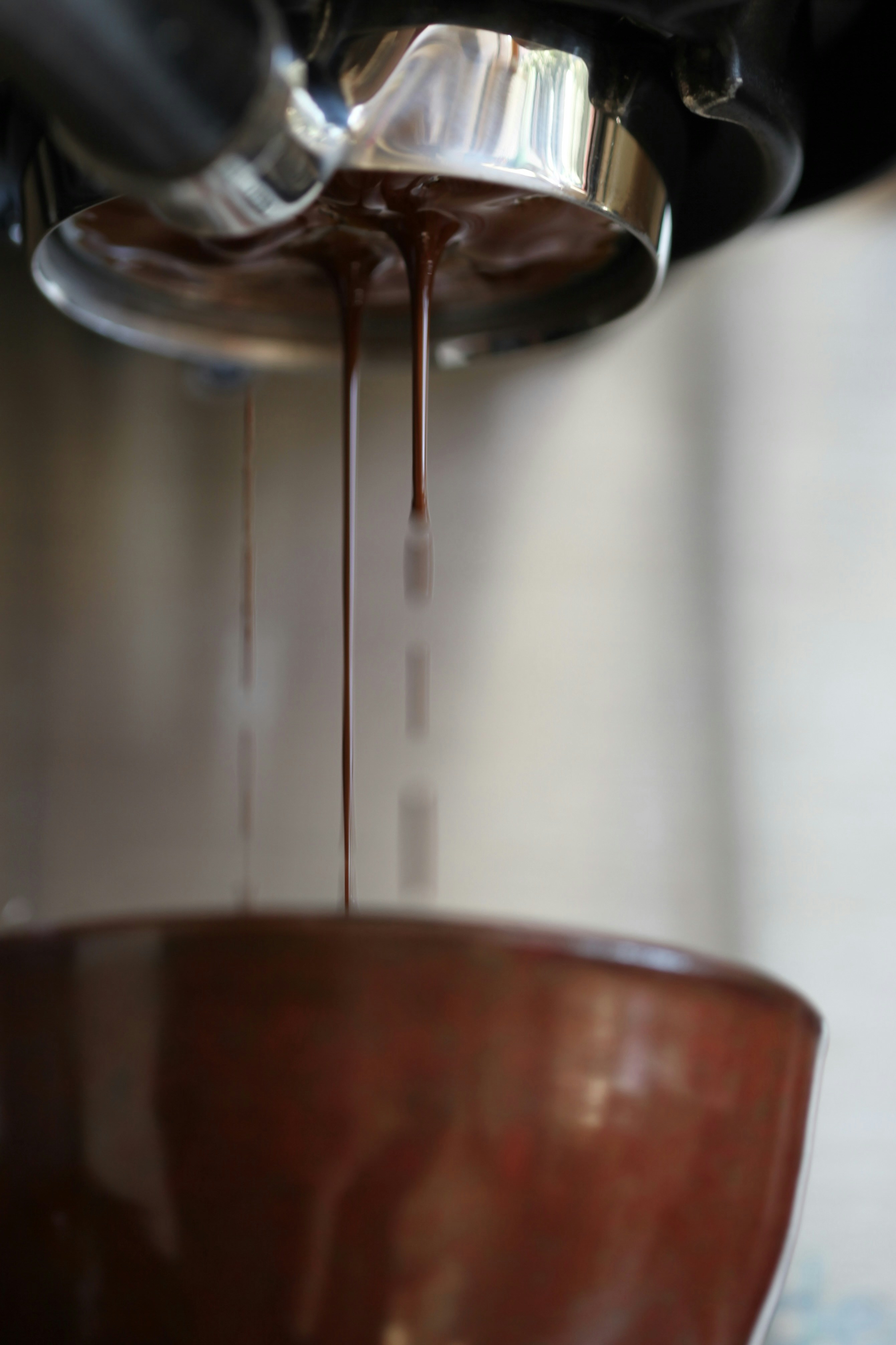 Coppery Espresso Threads: A Close-Up of Slow-Pouring Richness