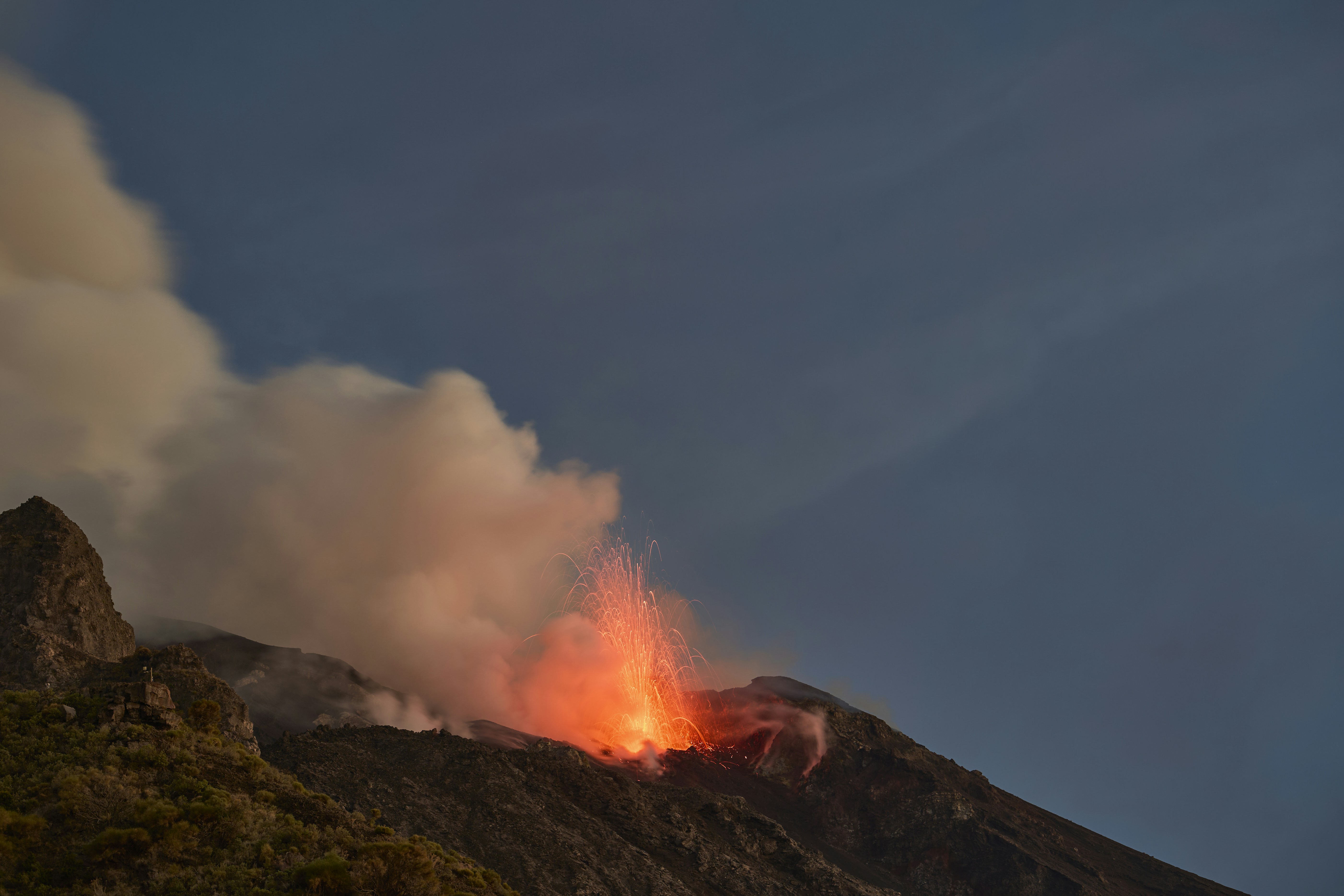 Lava Spurts from a Cracking Ridge at Dusk