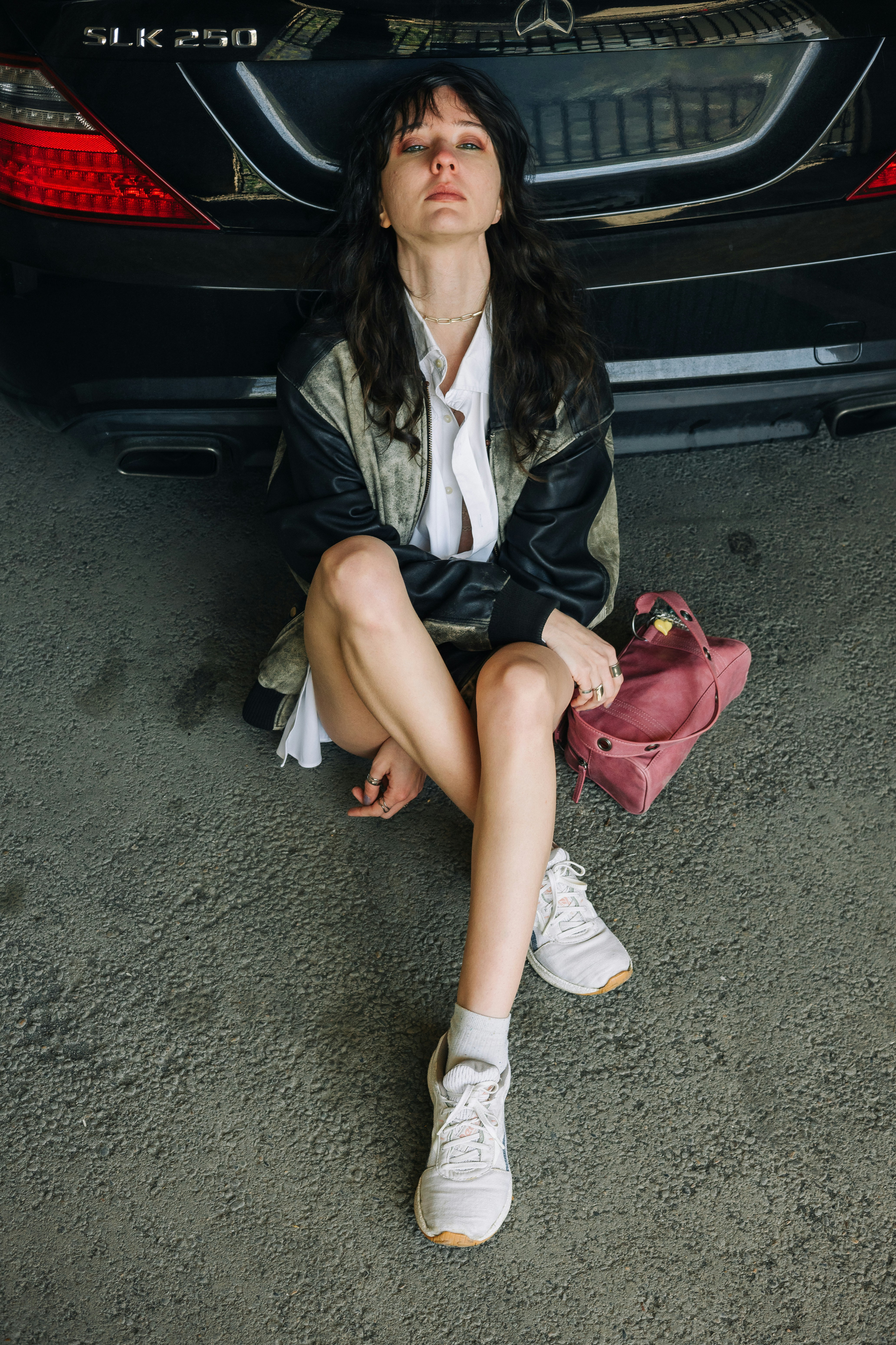 Neon Velvet: A Quiet Repose Behind a Mercedes
