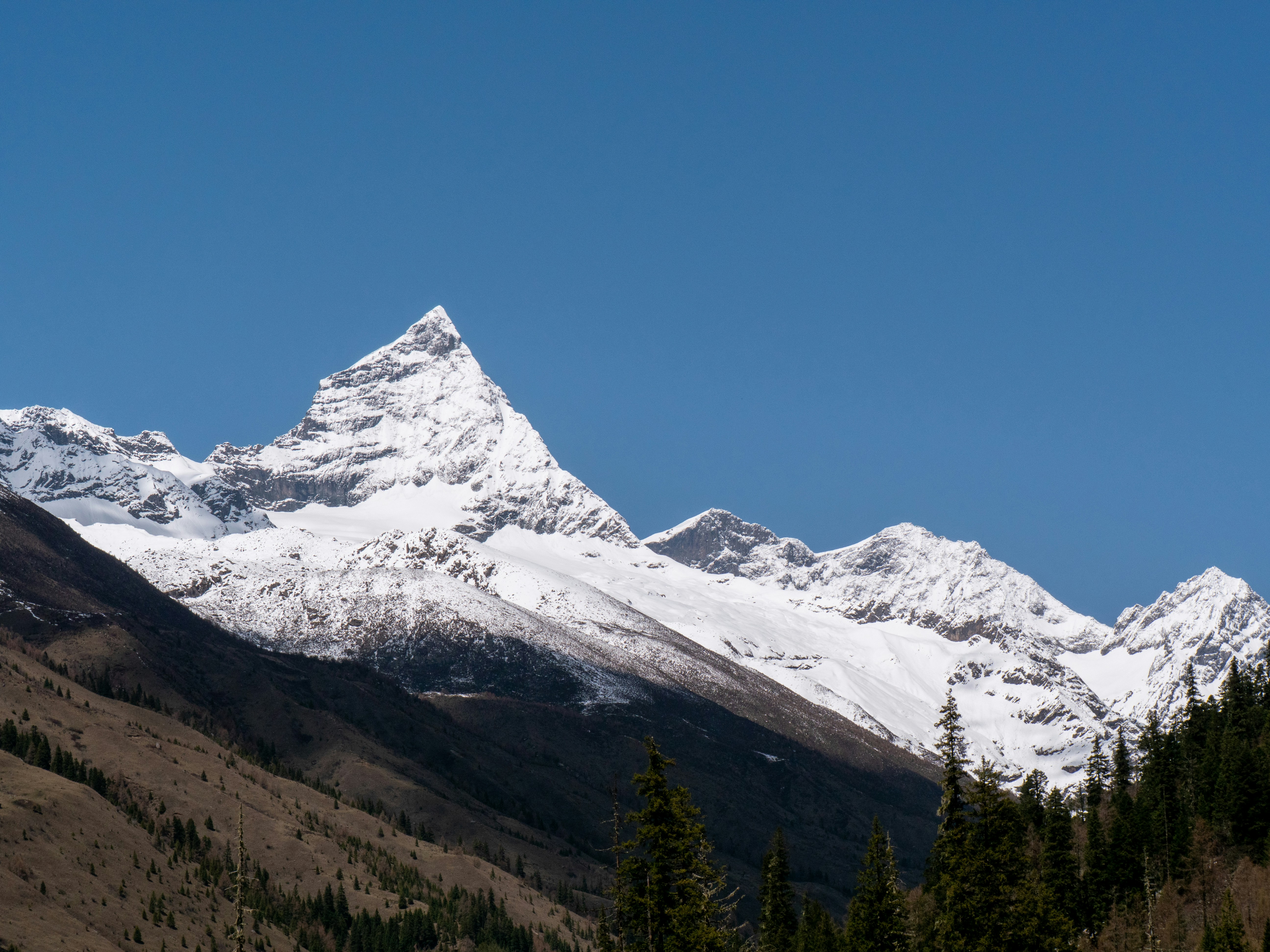 Snow-Crowned Peak Reaching into Sky