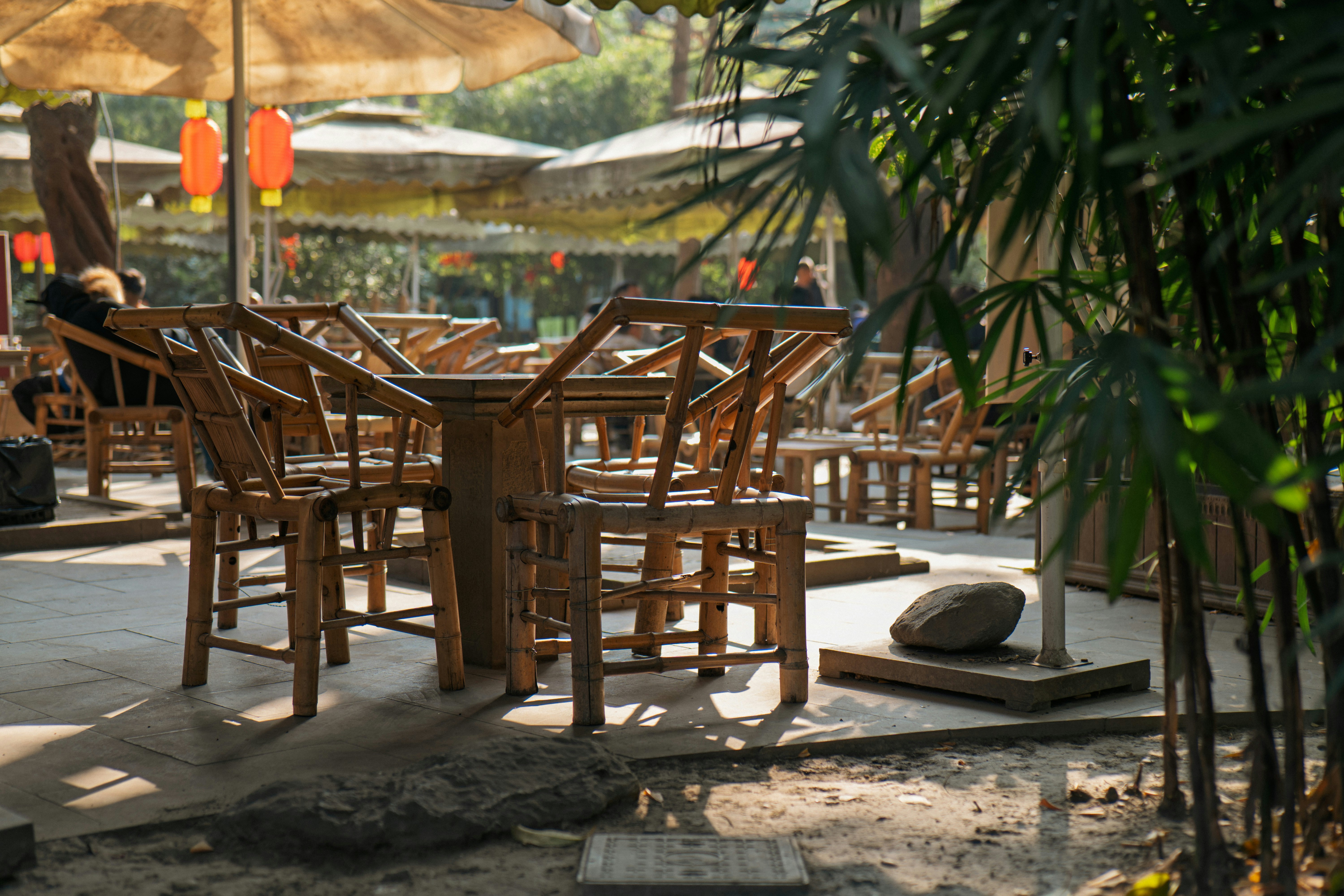 Sunlit Terrace: Wooden Chairs Dappled in Amber Light