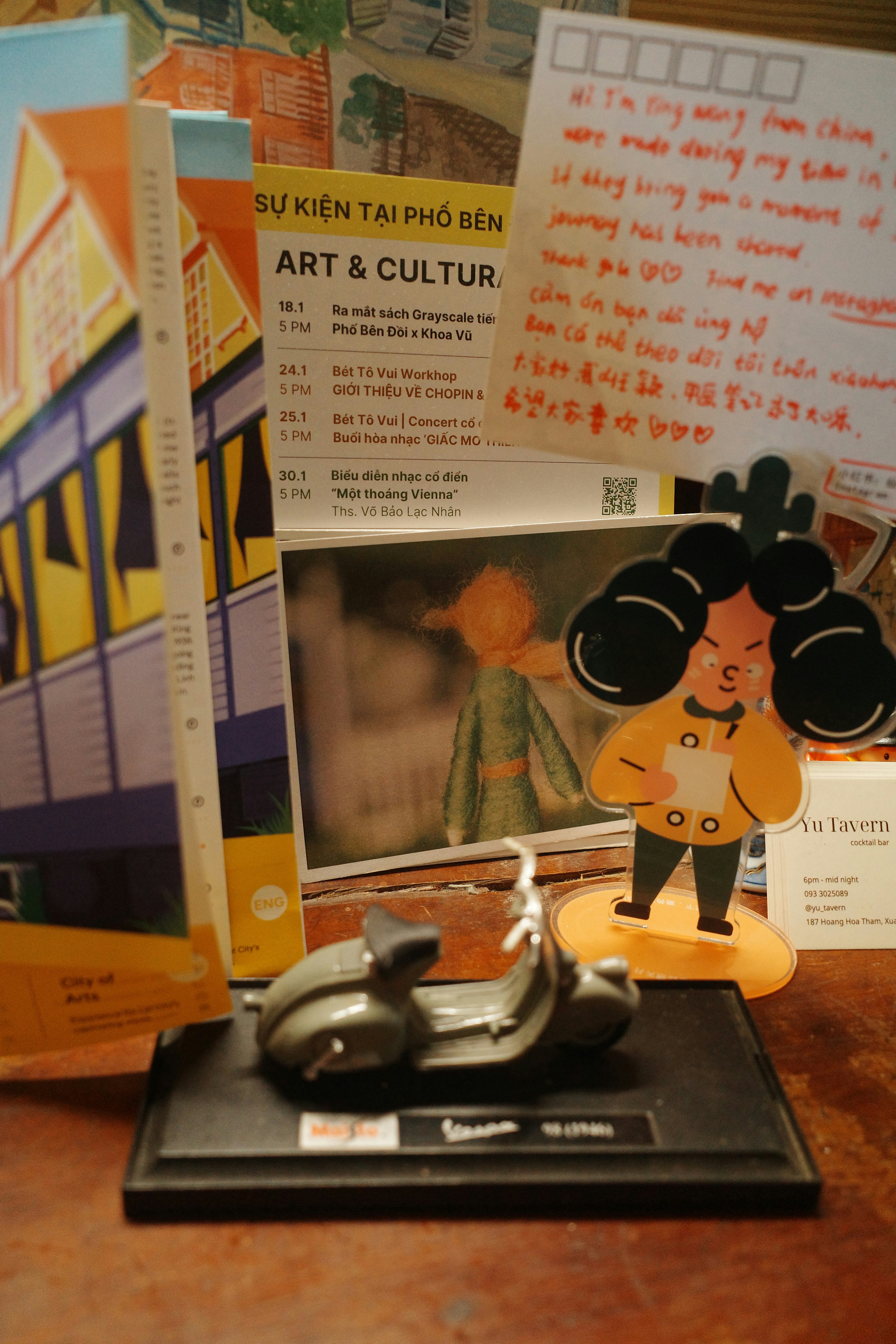 Figurine in front of a cluttered display