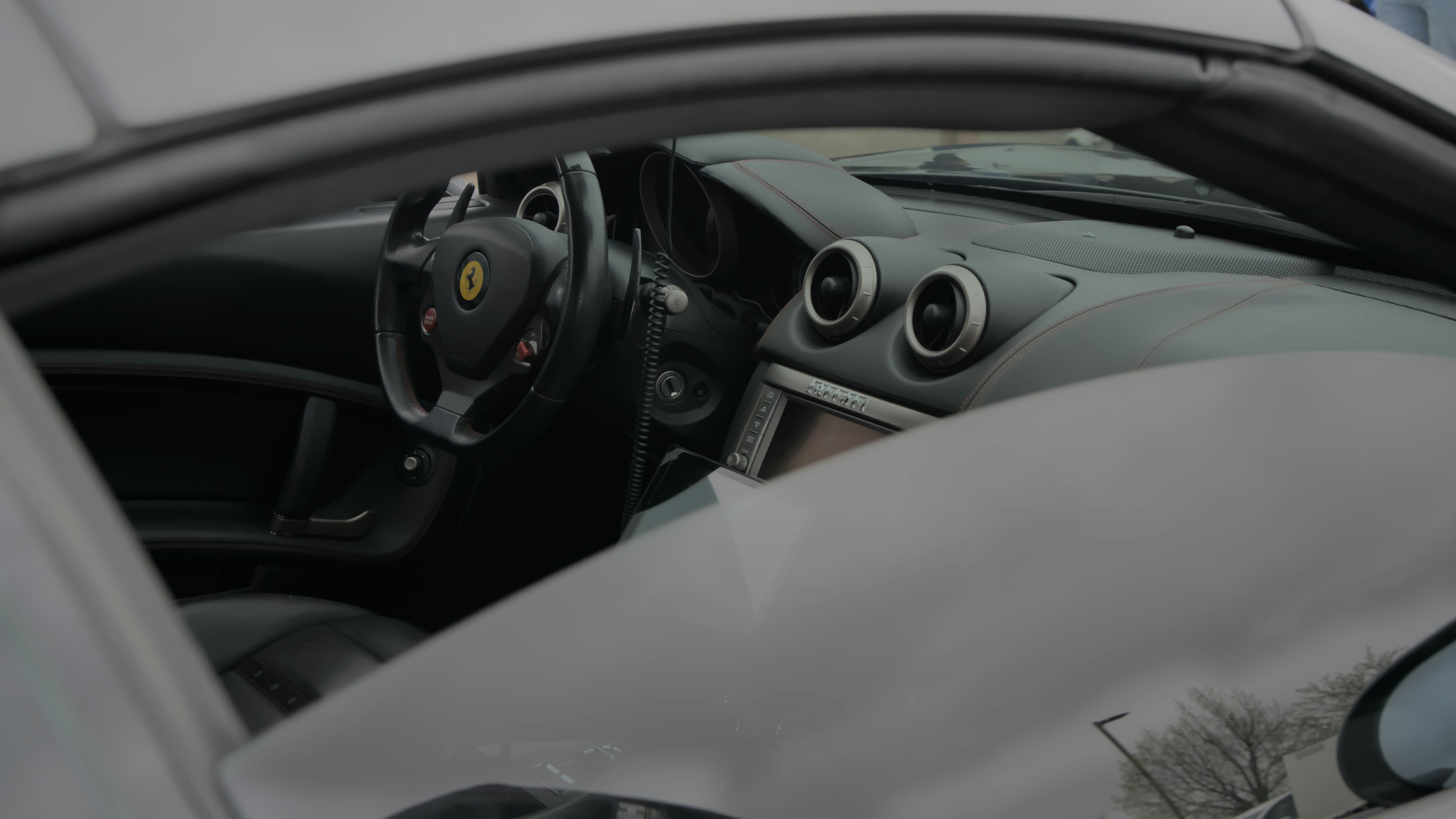 Ferrari cockpit: a glimpse through a sculpted dashboard and circular vents