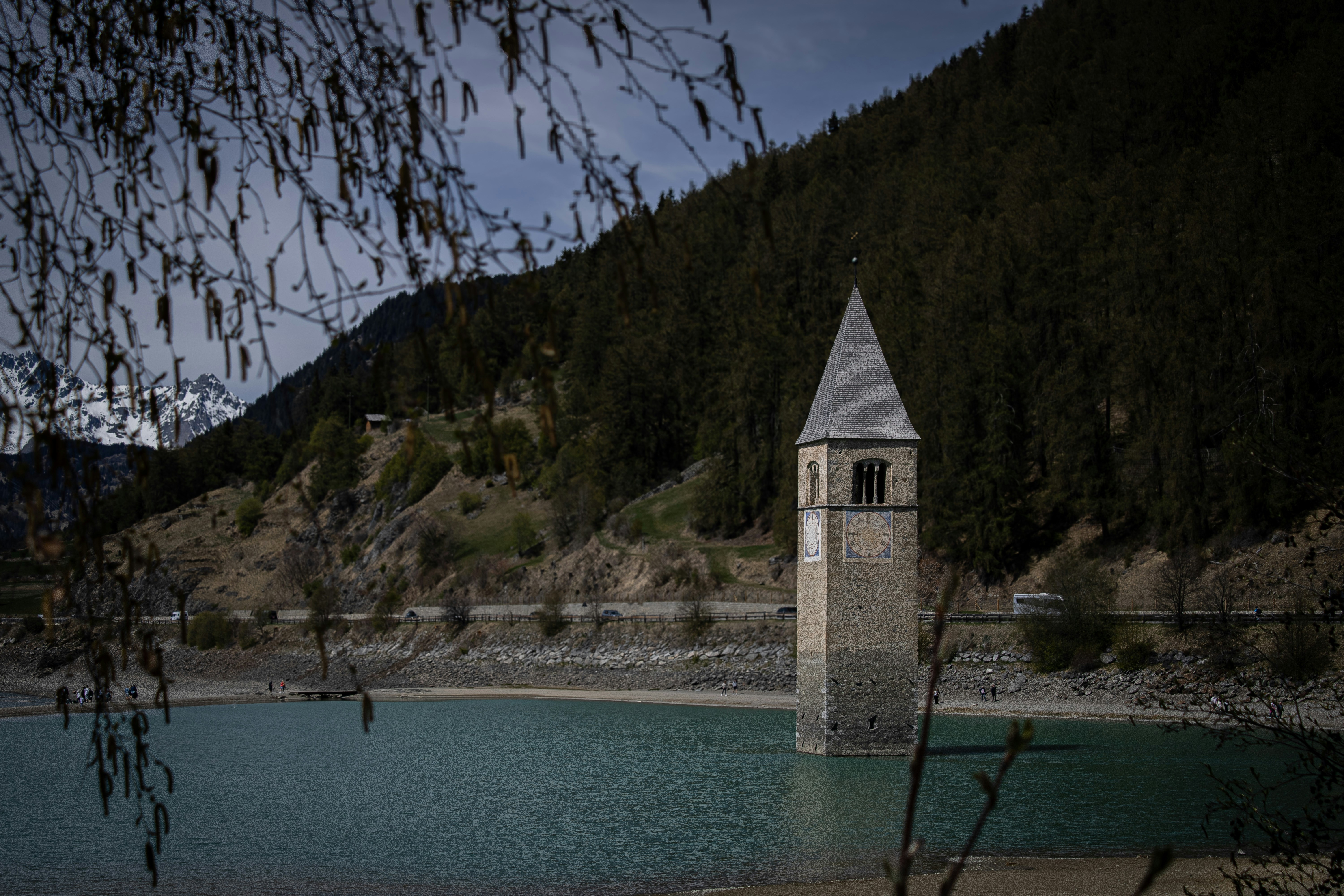 Tower by the Turquoise Reservoir: A Quiet Alpine Moment