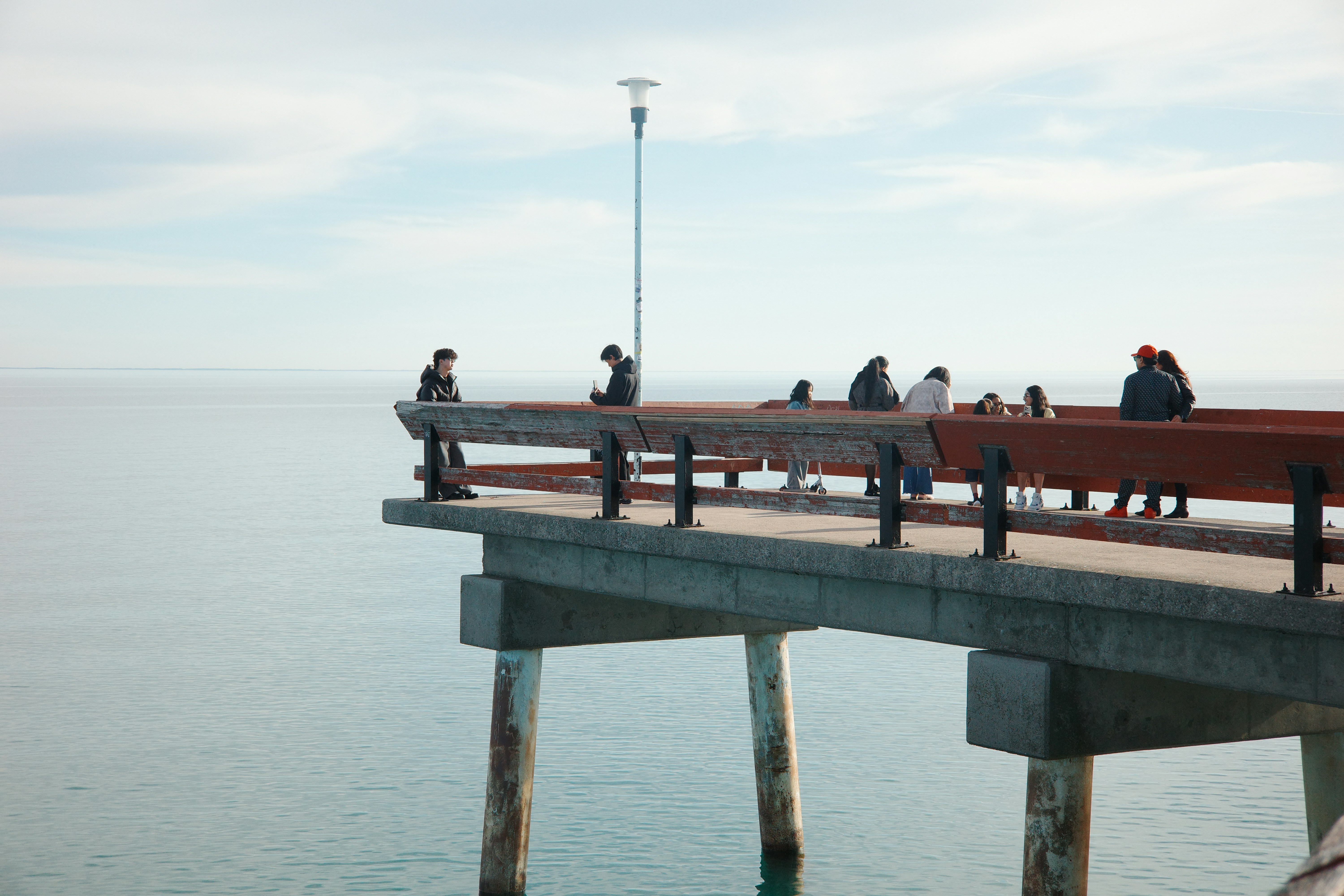 Pierhead People: A Quiet Moment Over the Sea