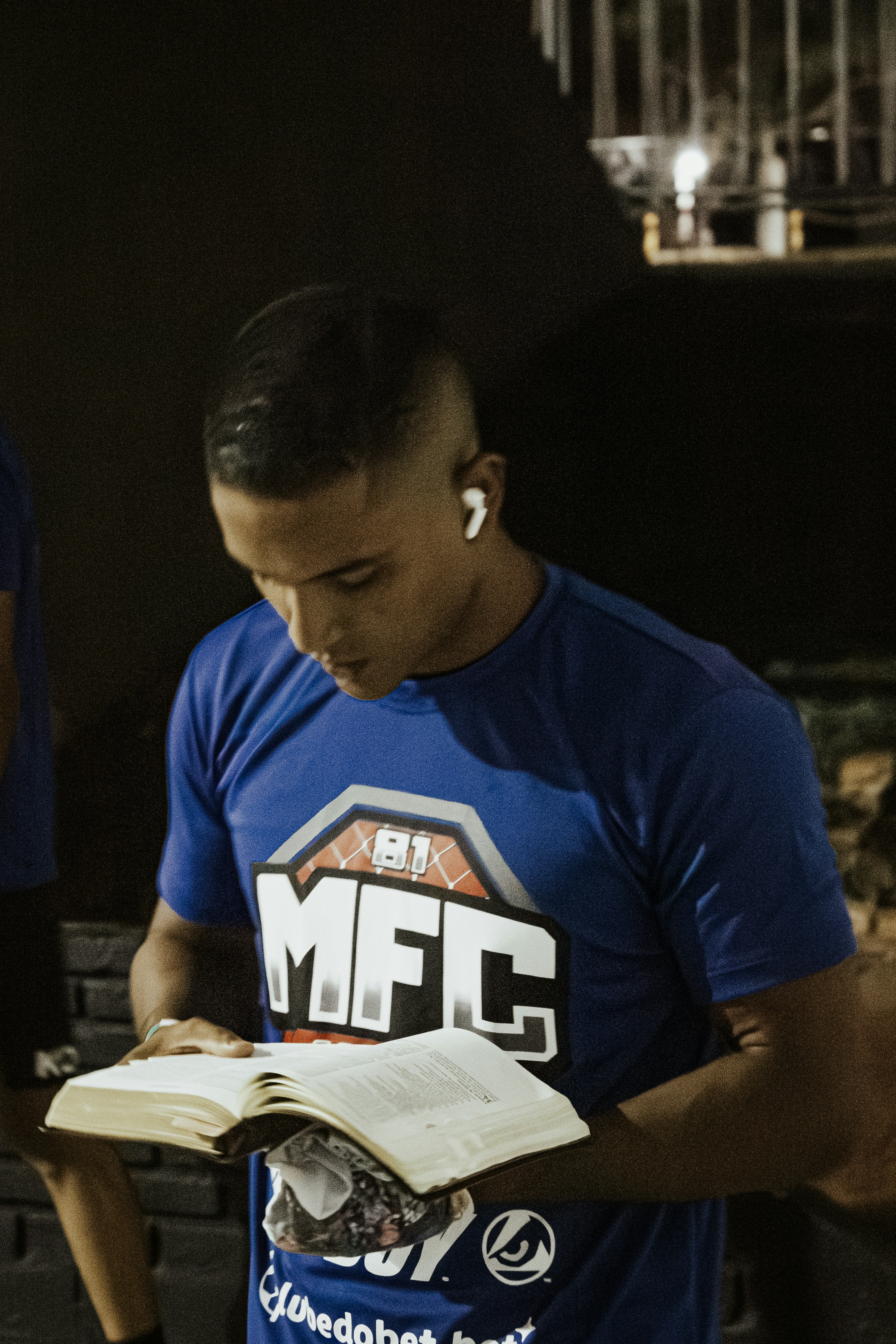 Reading in the Night: A Focused Moment in Blue