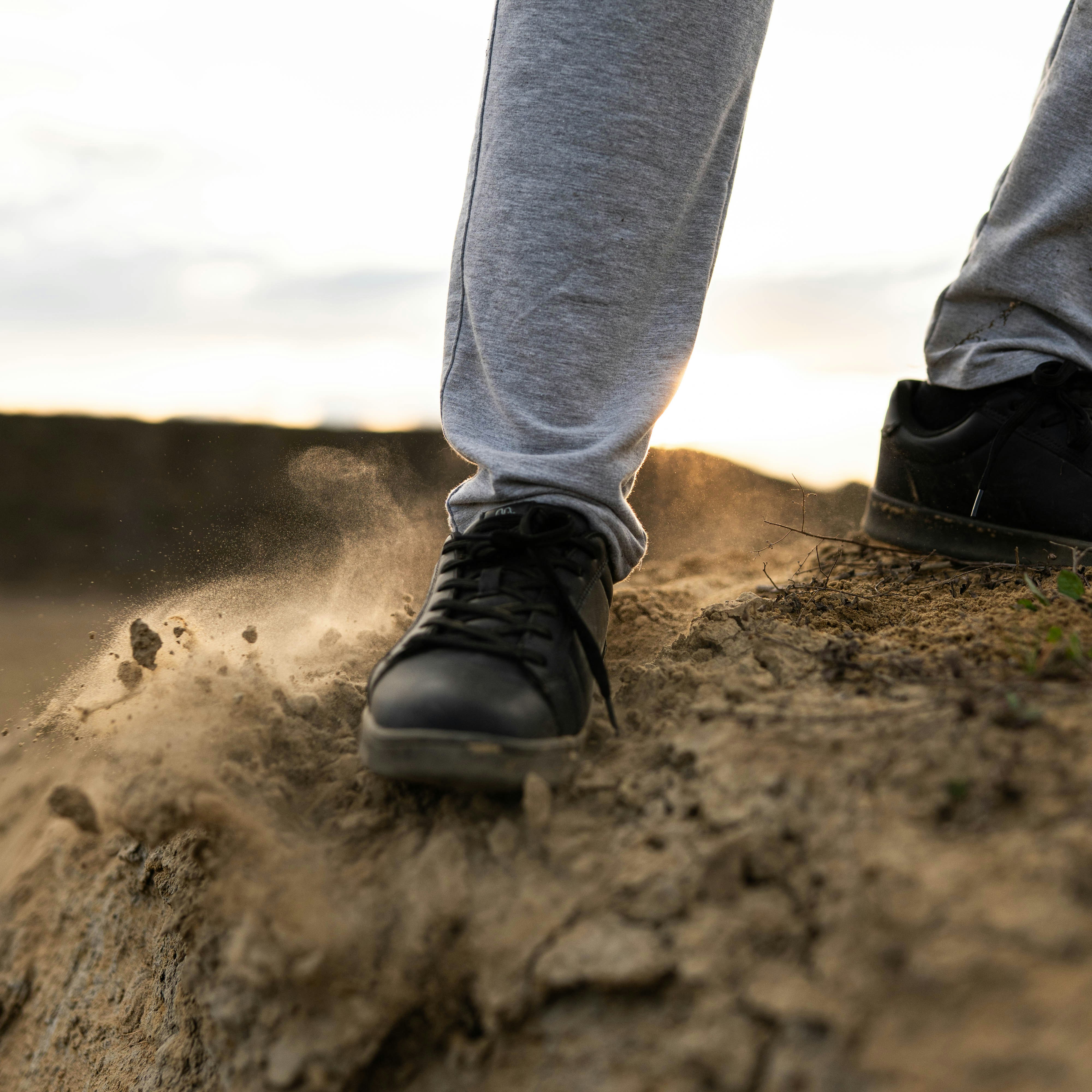 Booted Foot Steps in Dust: A Closer Look at Ground-Level Motion