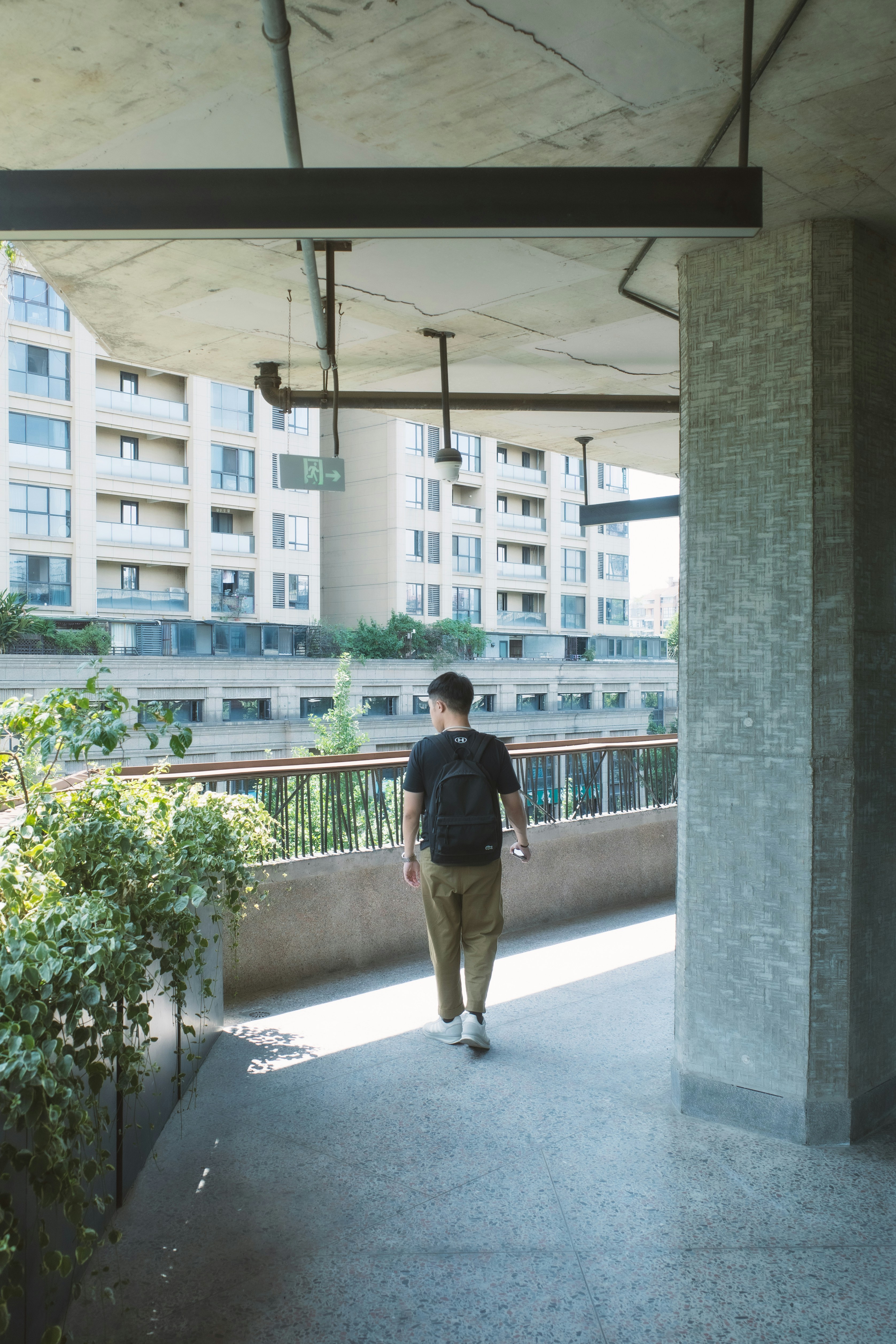 Walkway Portrait: A Student Heads Toward the City Beyond