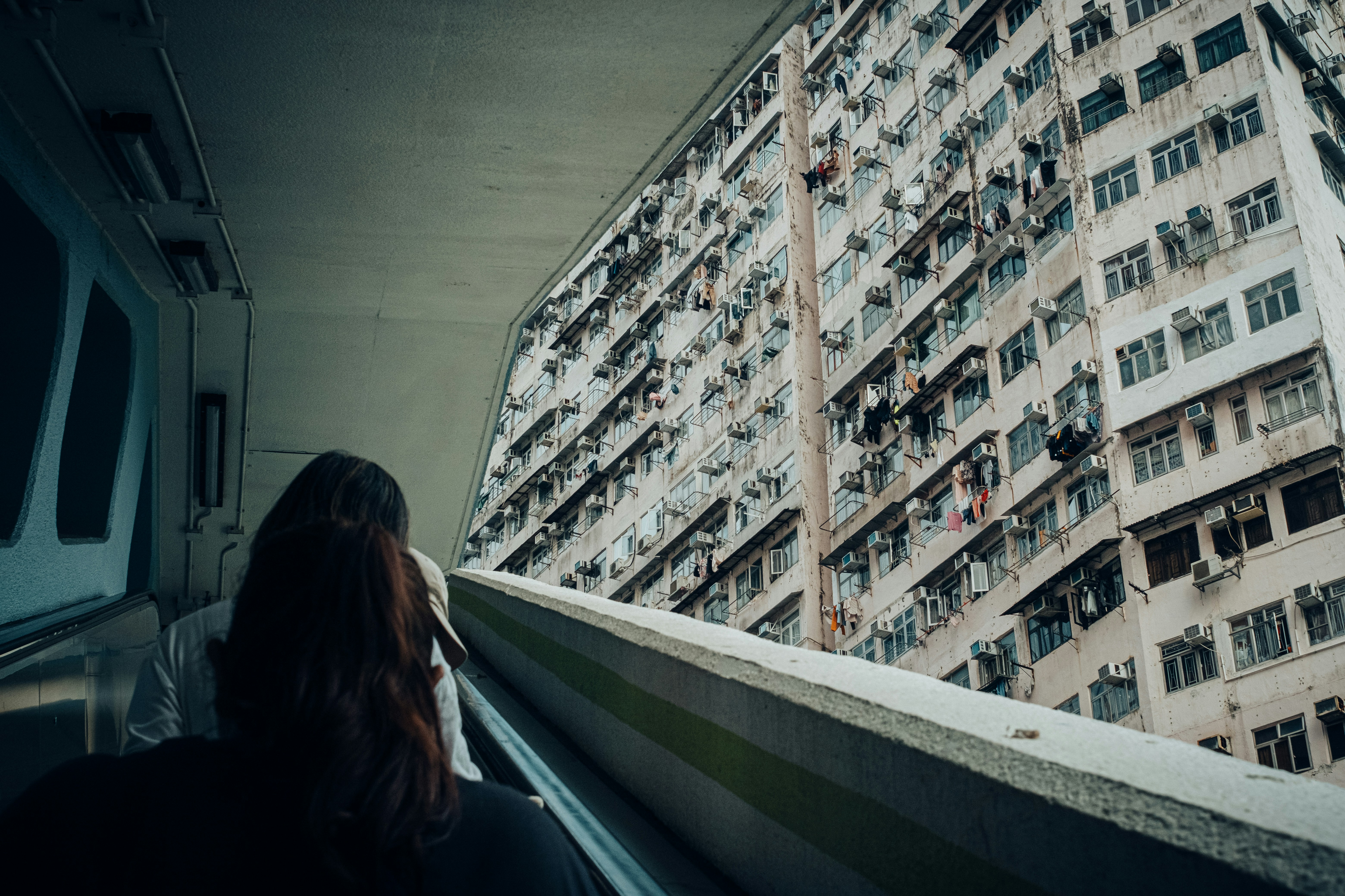 Escalator to the City: Faces Amid the Climb