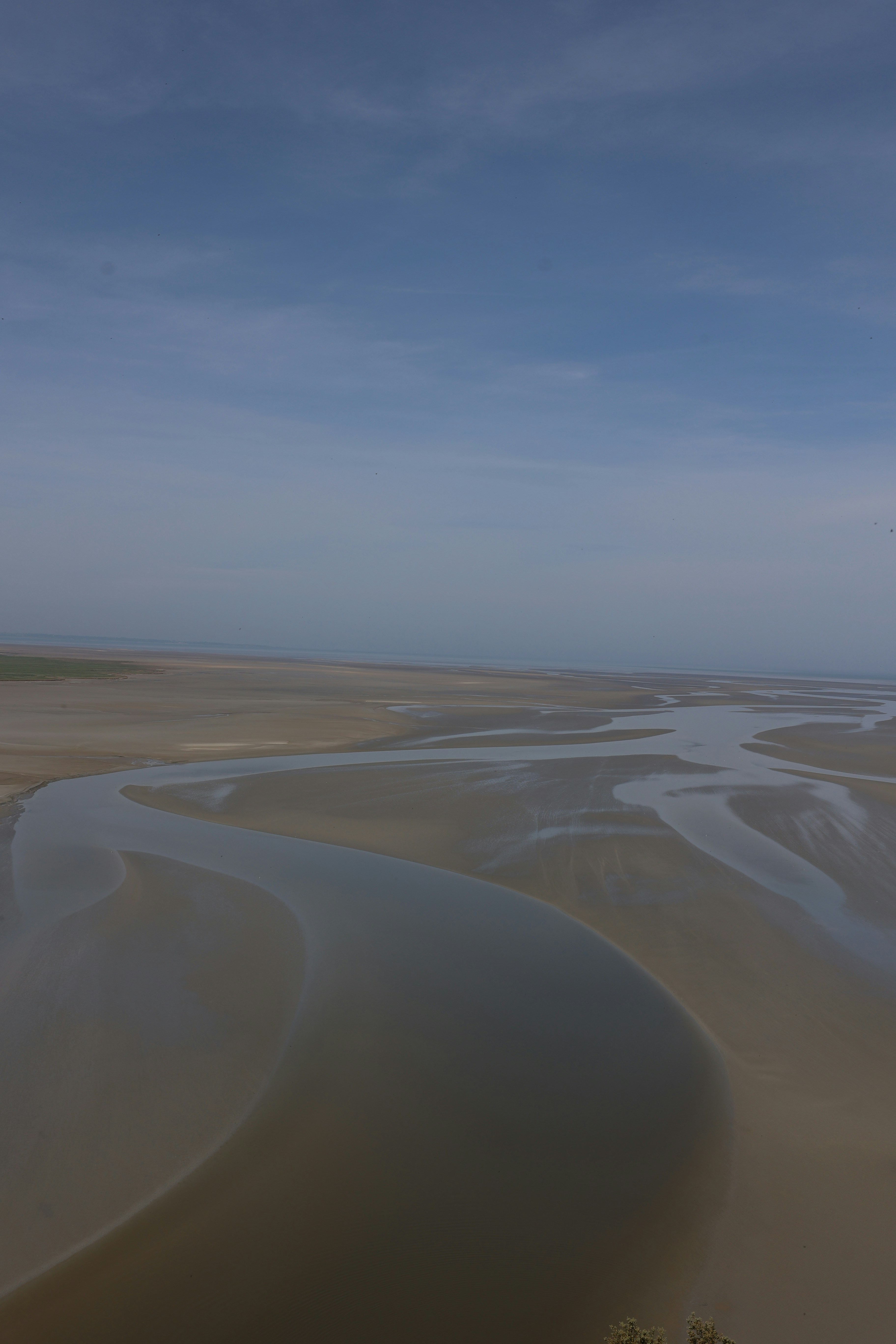 Meandering tidal channels through a quiet sandy estuary
