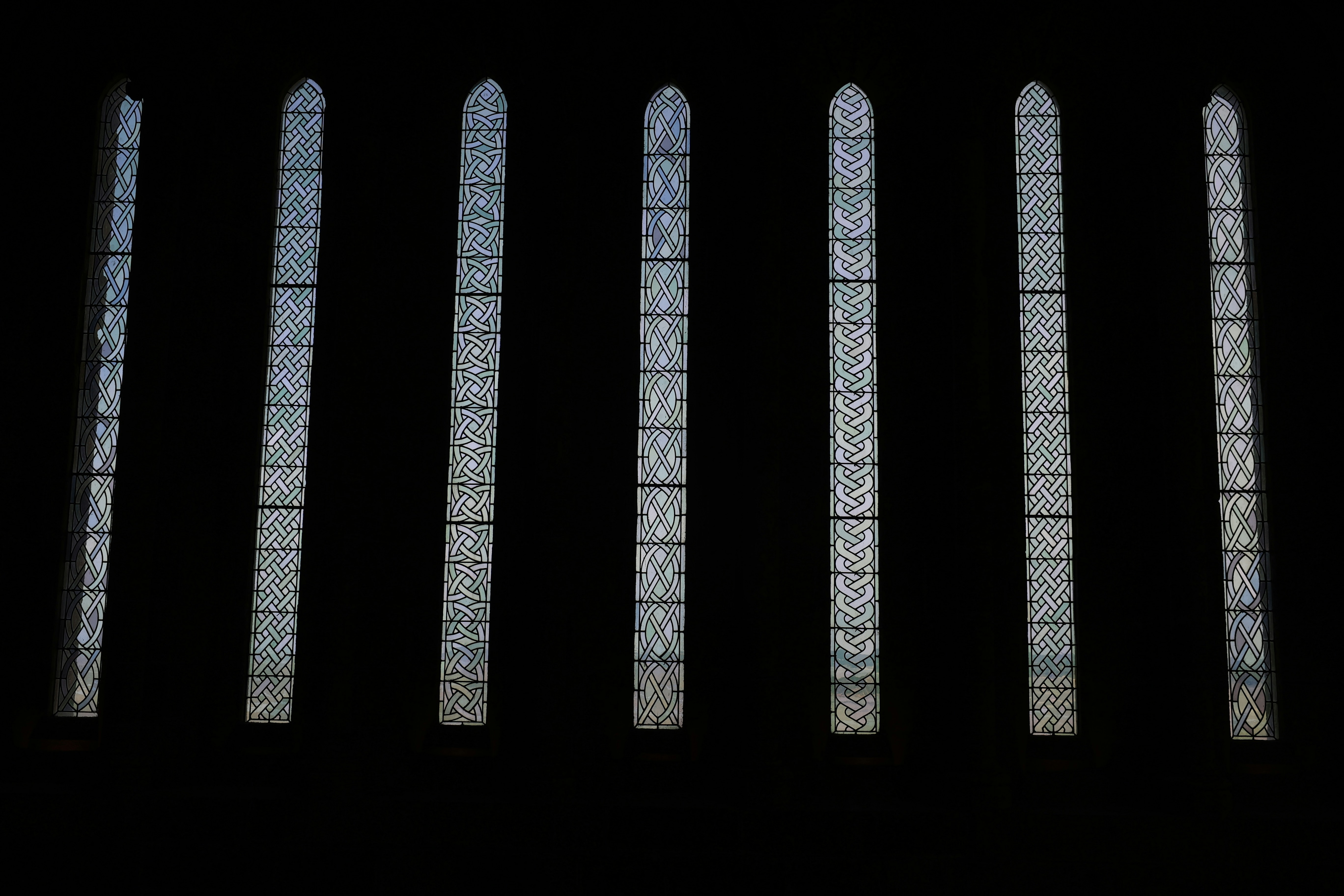 Vertical Stained Glass Slots in Dim Chapel