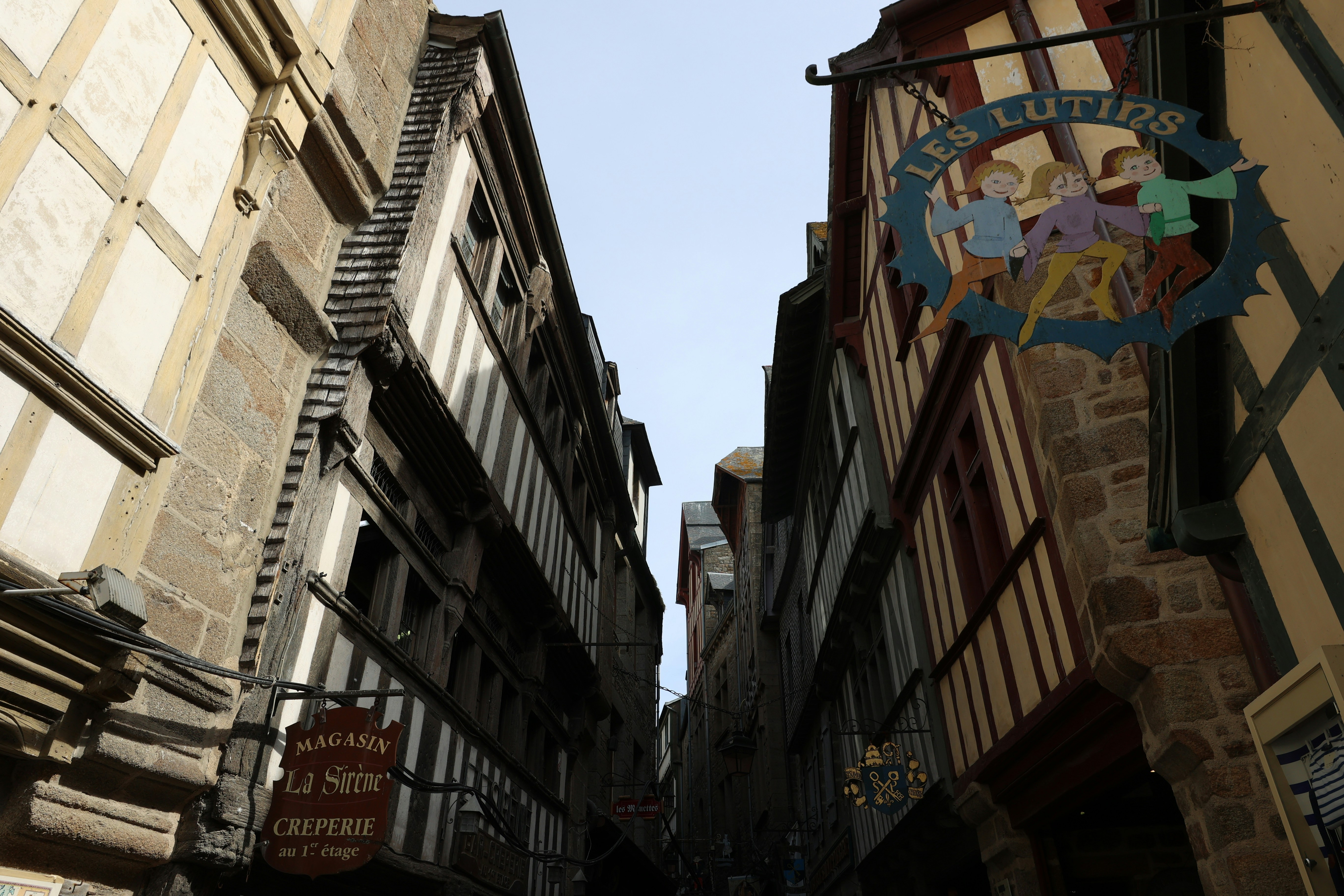 Cobblestone Alleyway Between Timbers and Signage