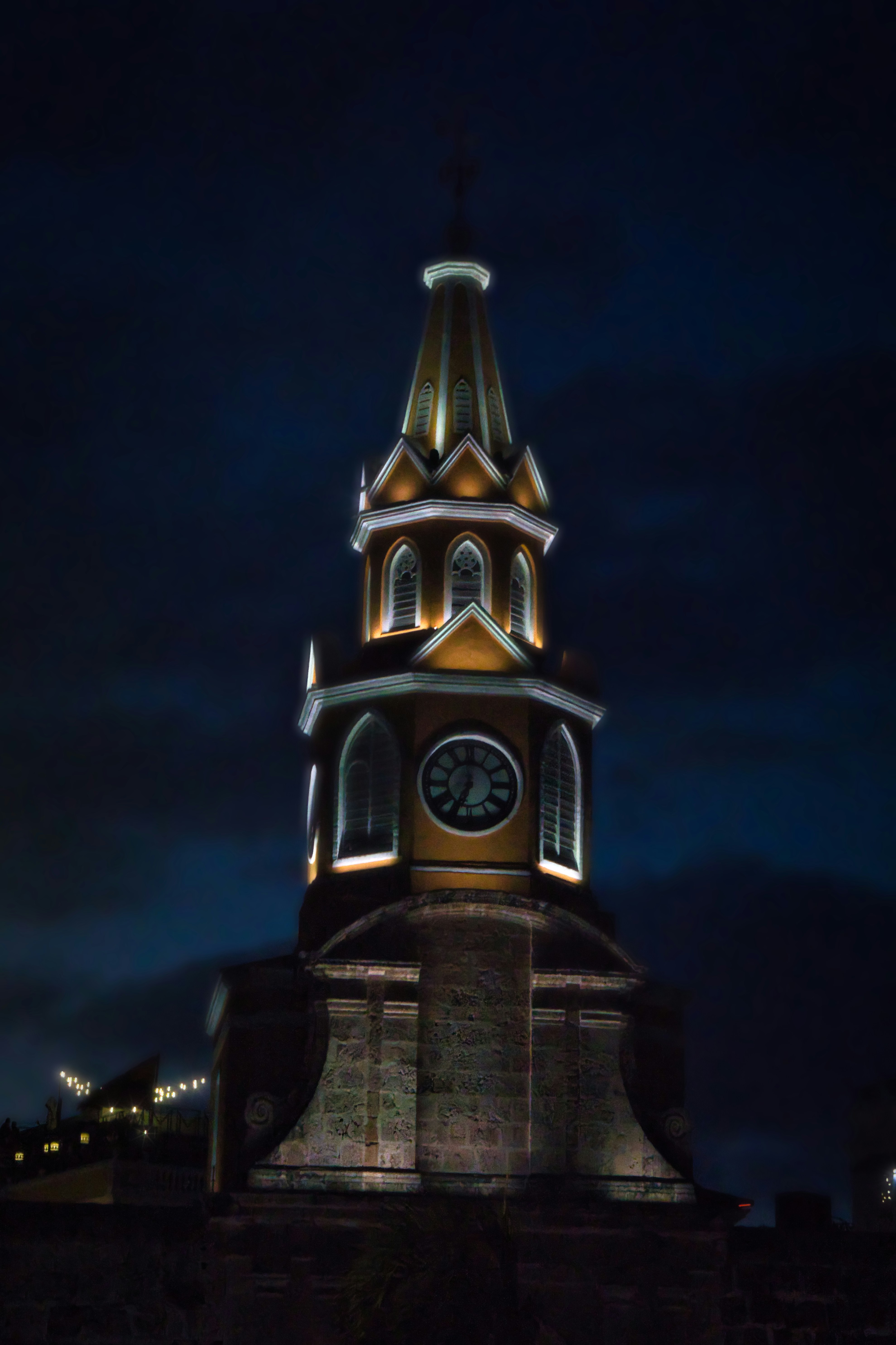 Nocturnal Clocktower: Gilded Spire Rising Above Old Stone