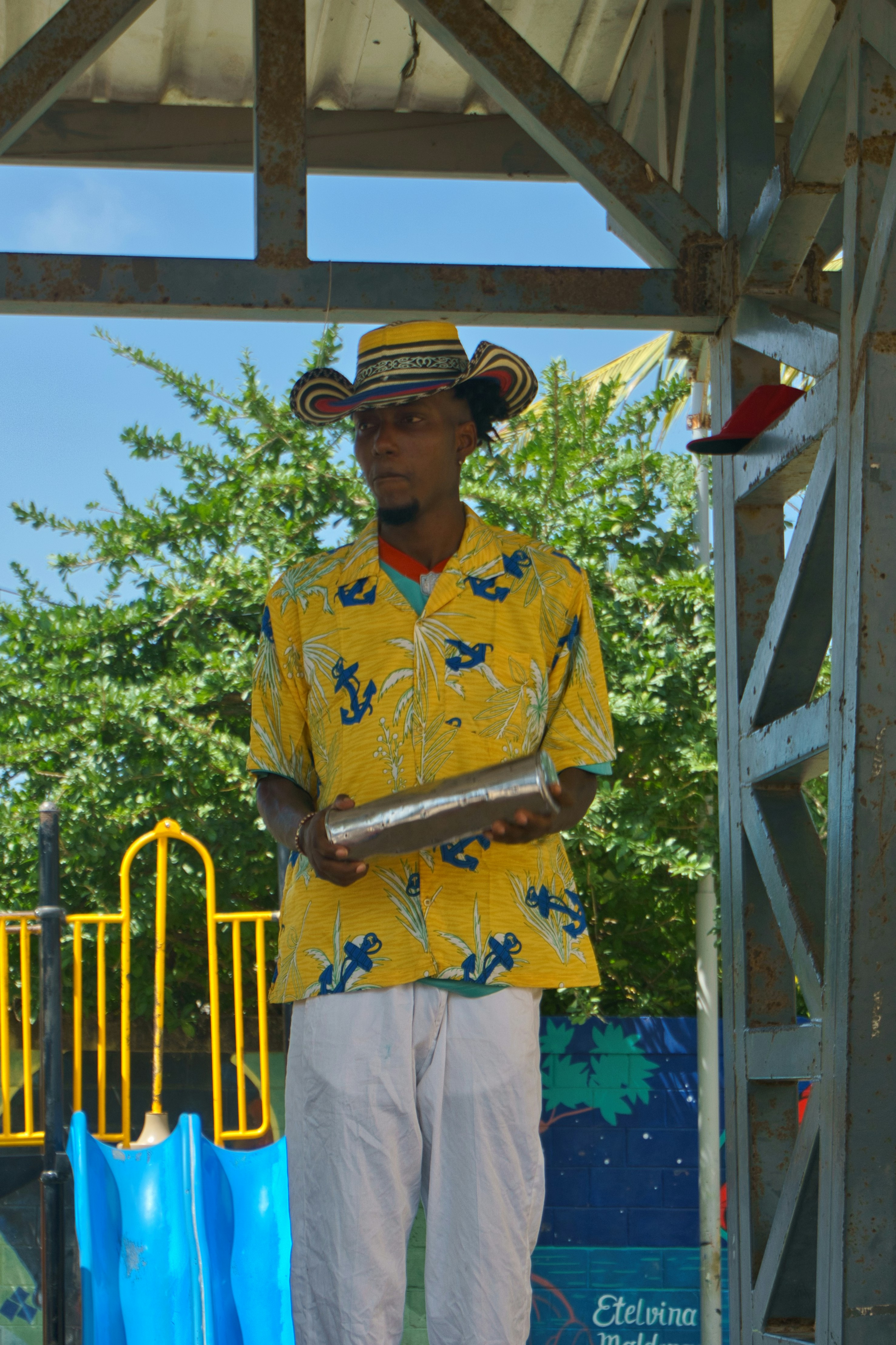 Sunlit Gambler: A Vibrant Portrait Beneath Steel Beams