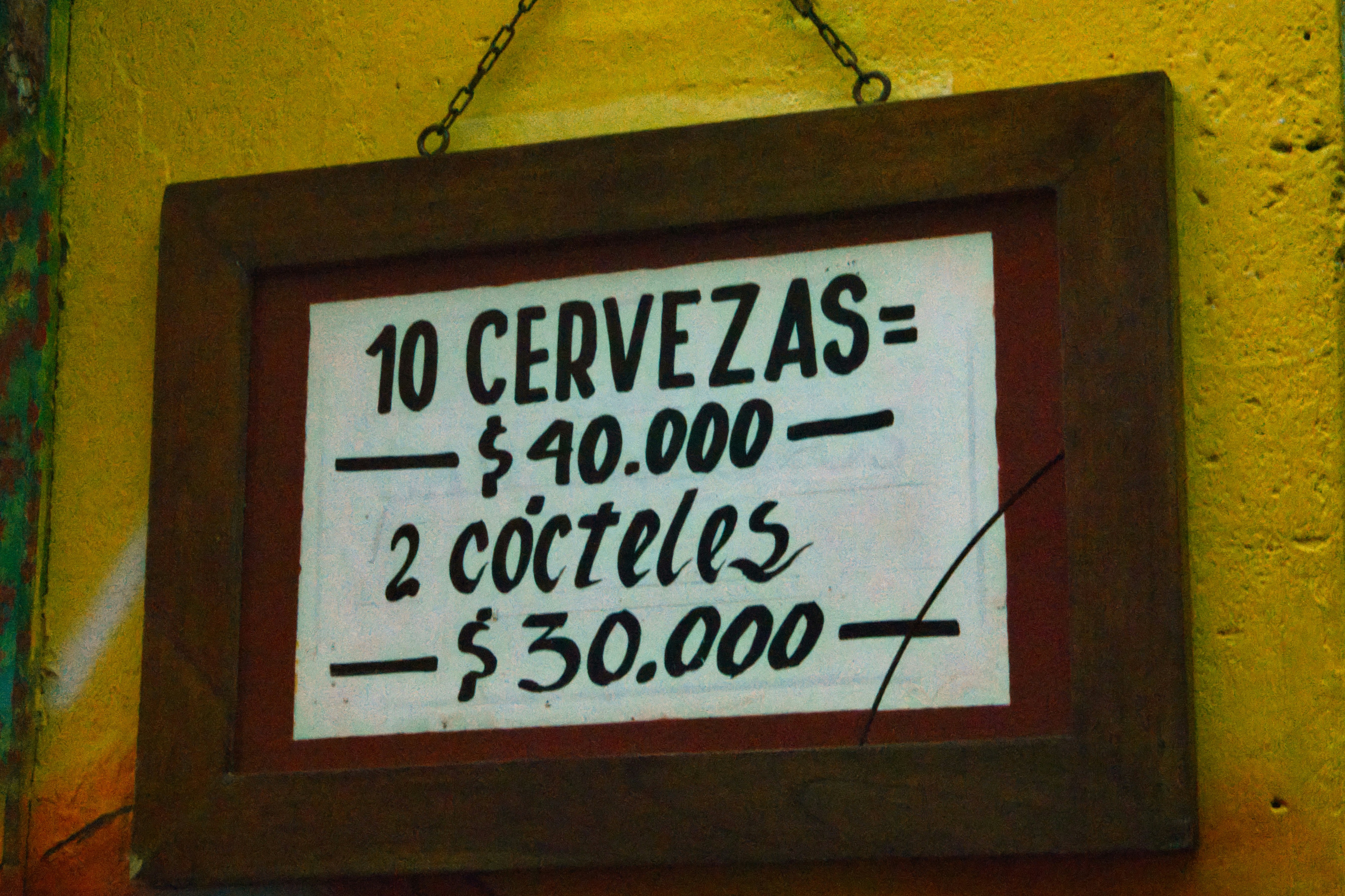 Signboard of local beer and cocktails in a rustic frame