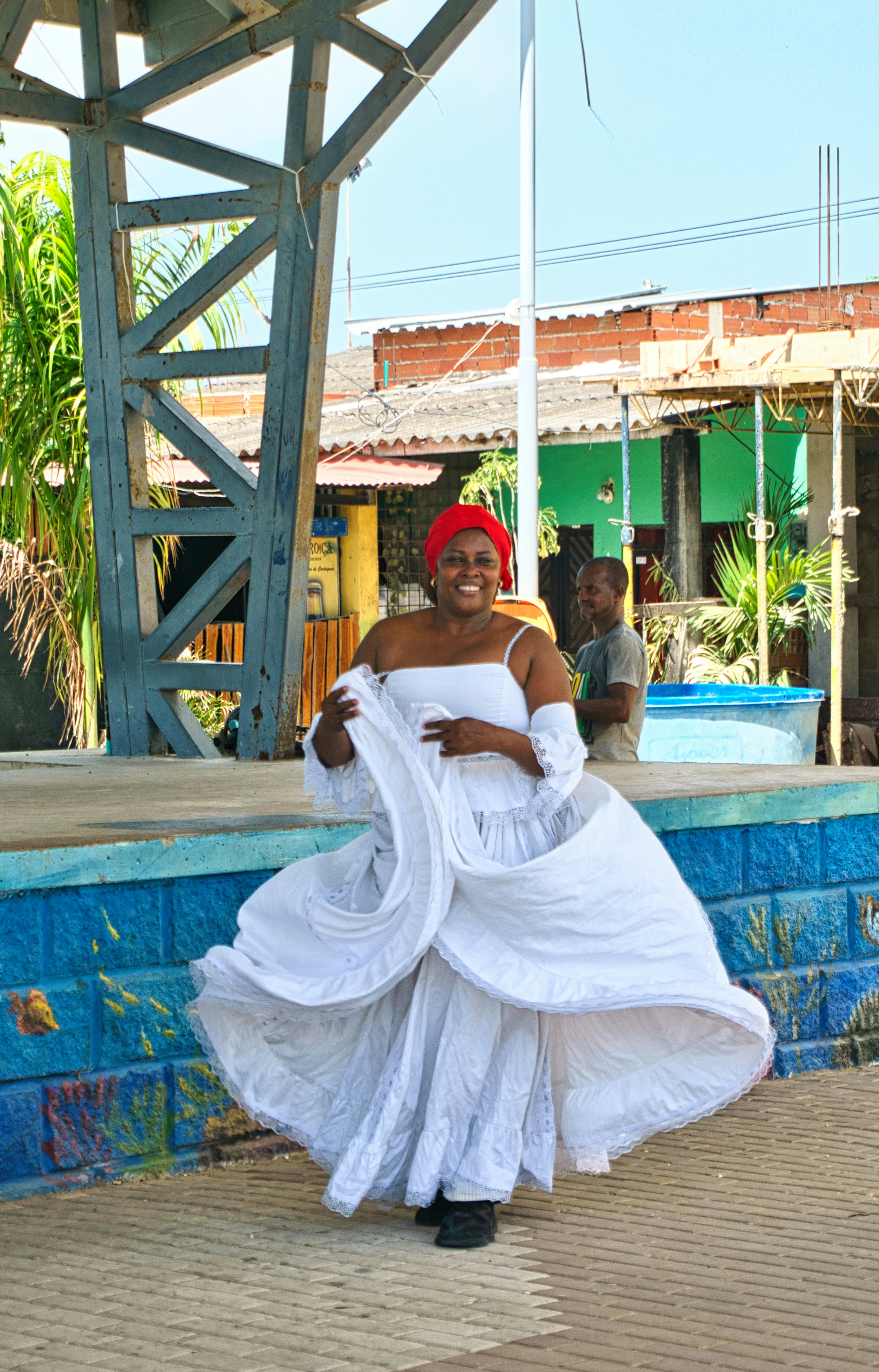 White Dress in Motion Under a Beachside Pavilion