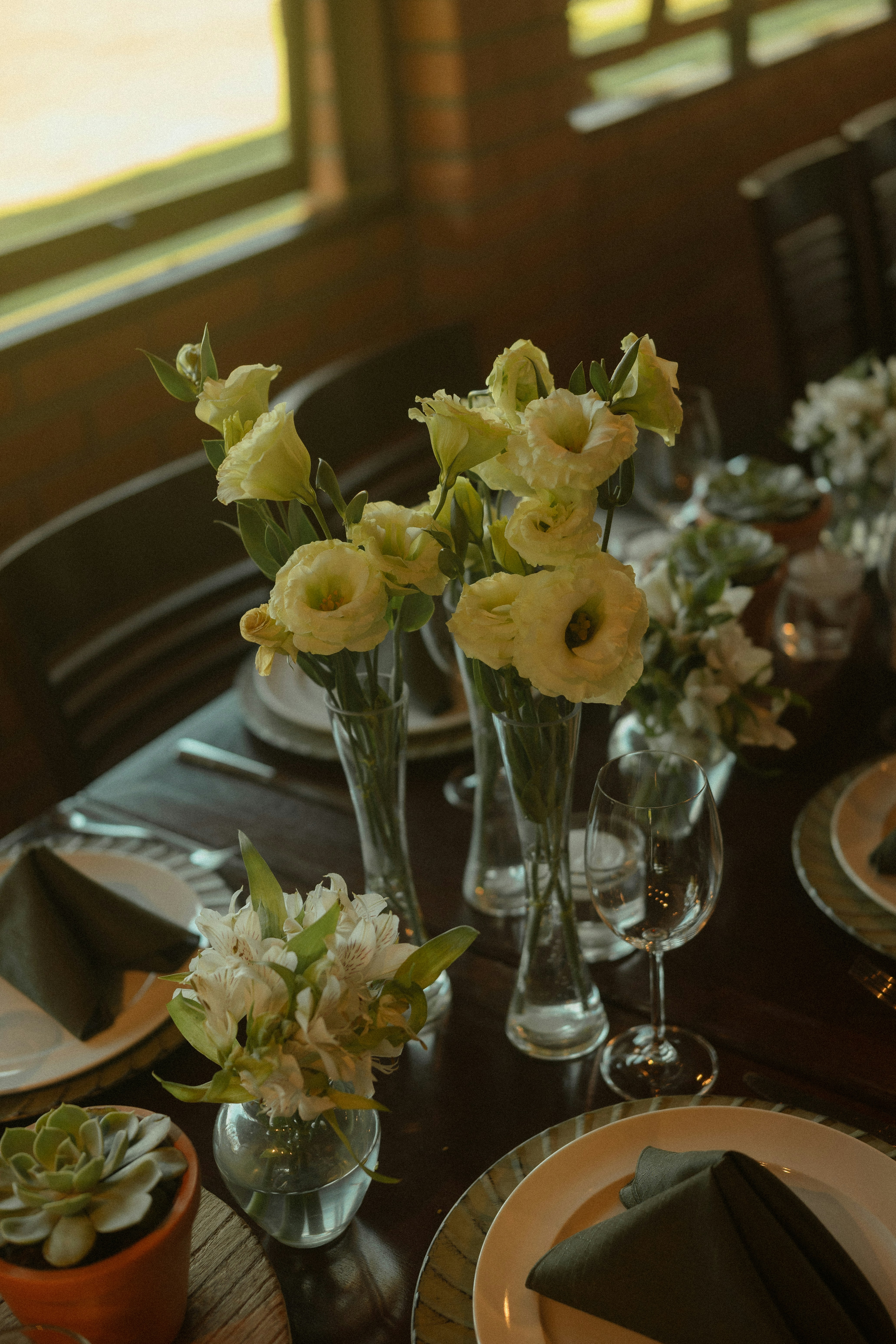 Sunlit Floral Centerpiece on Rustic Table