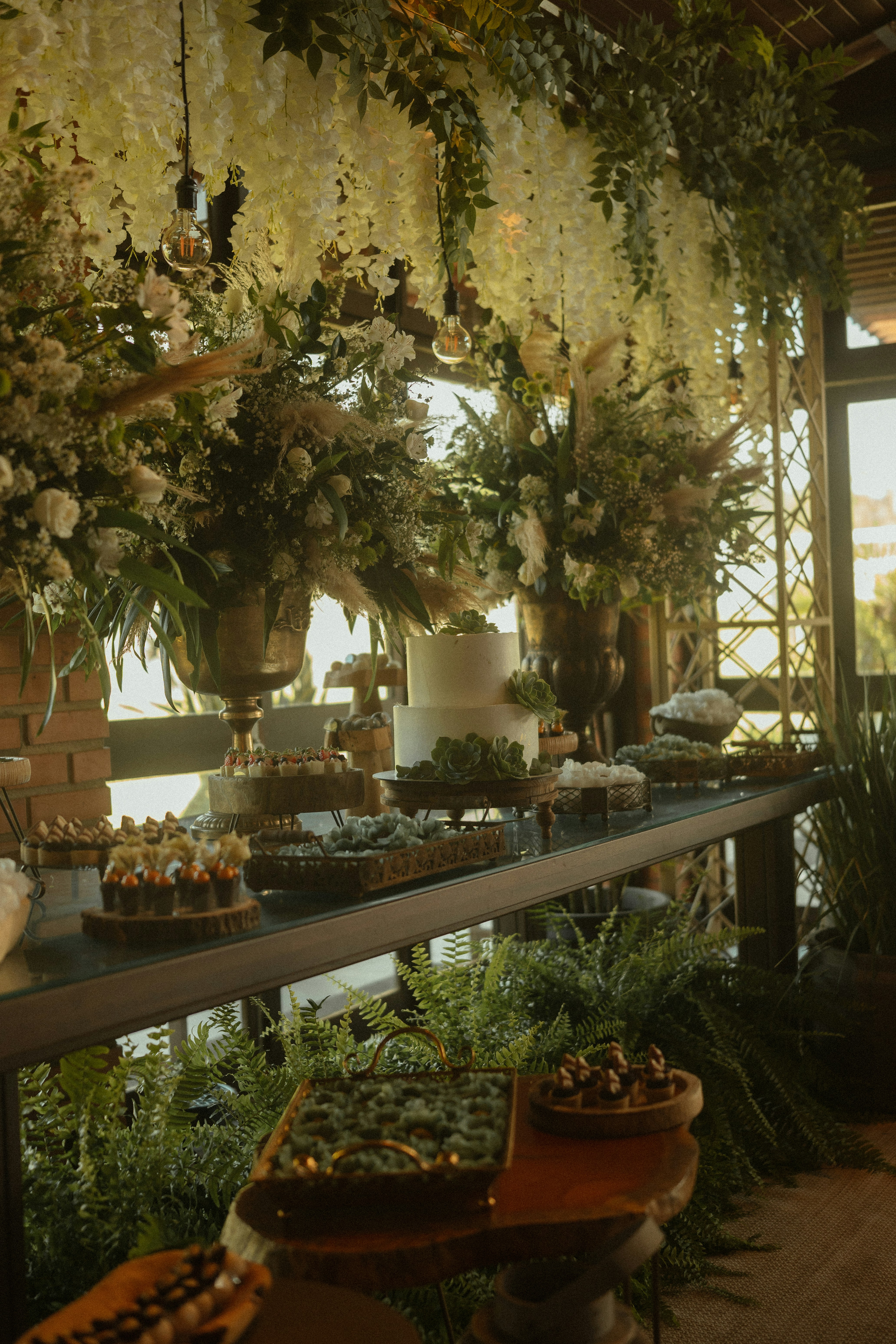 Floral Feast: A Dessert Table Beneath Cascading Blossoms