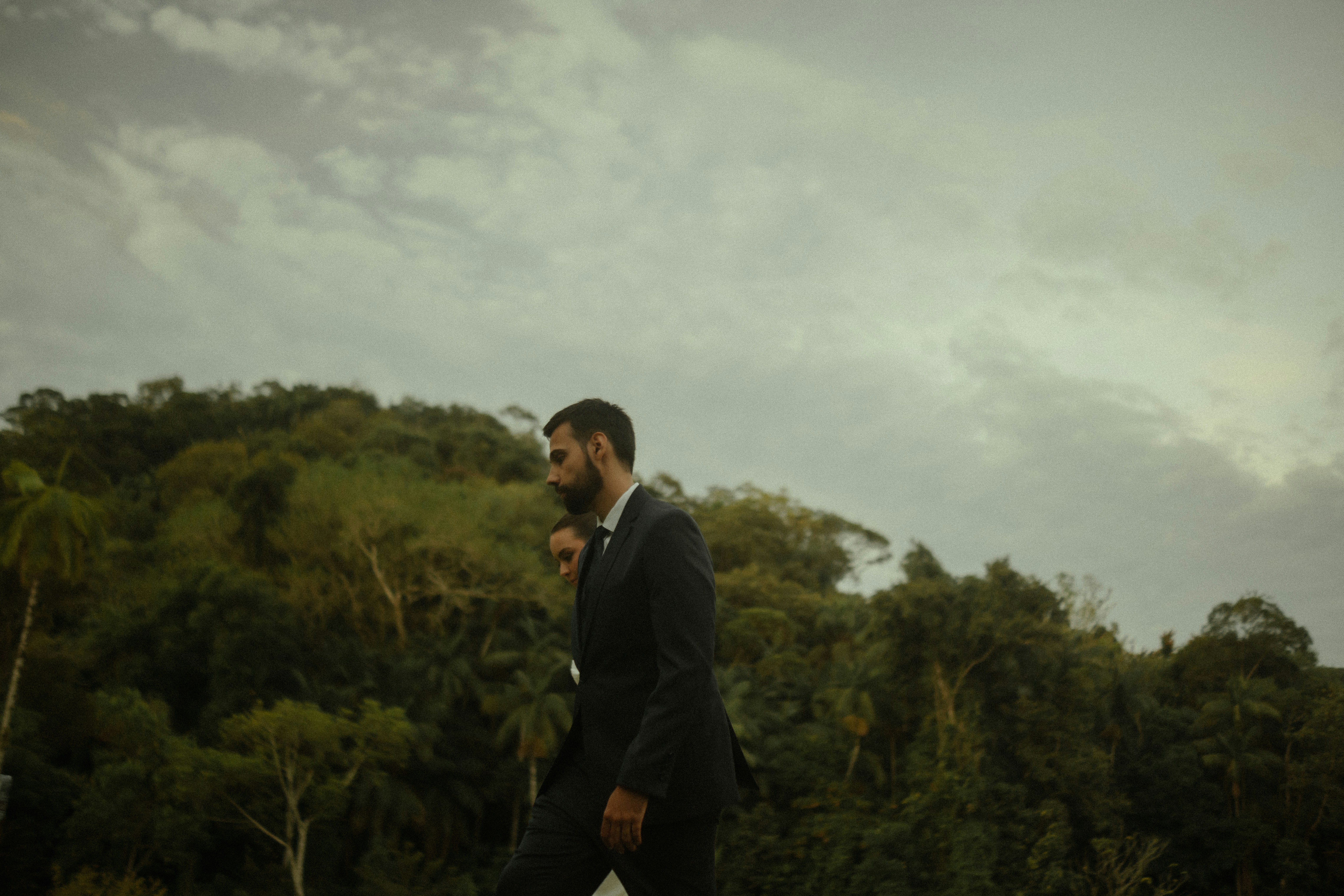 Two Gentlemen in Step: A Quiet Moment Amid the Canopy