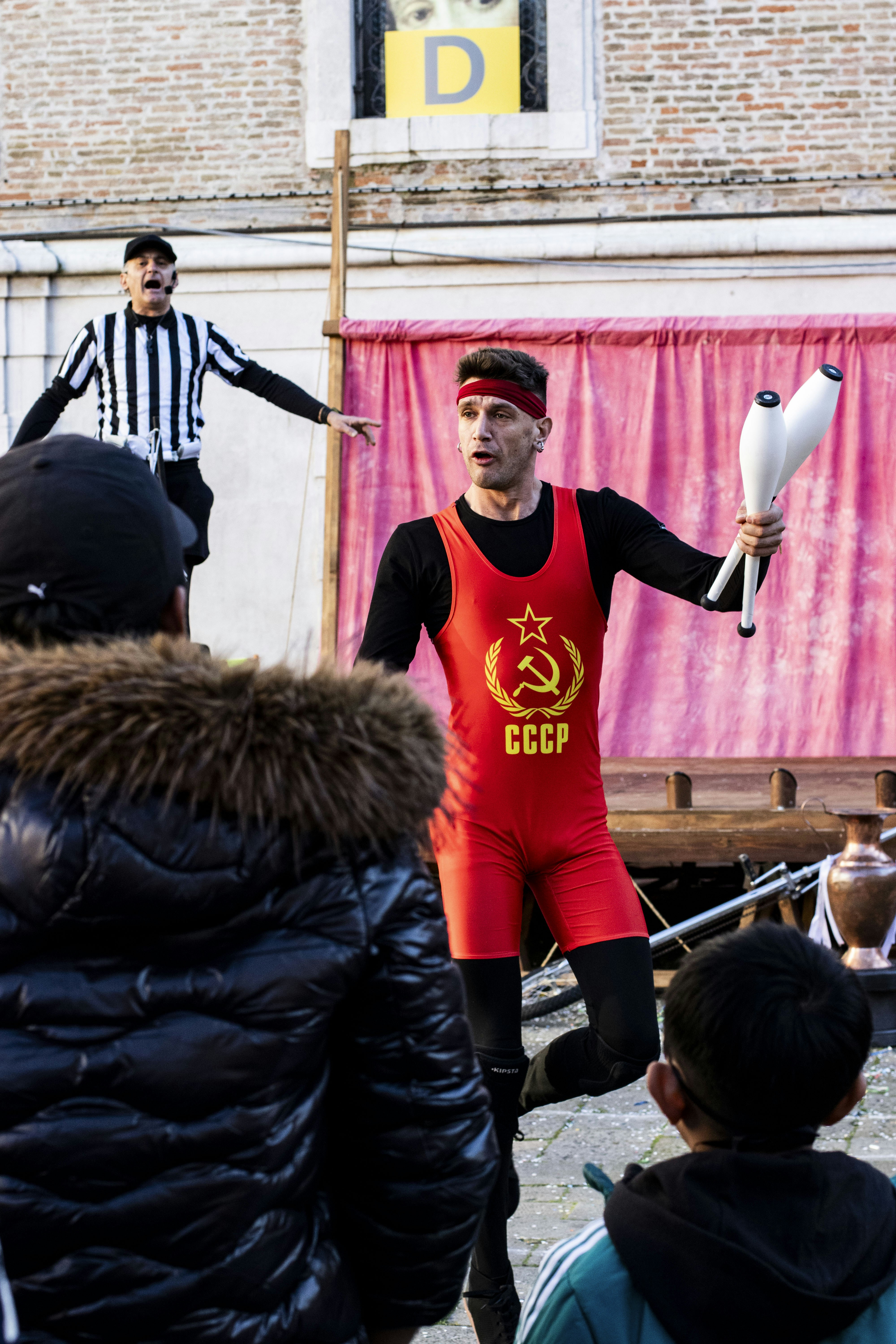Juggling Spectacle: Soviet Emblem and Striped Referee