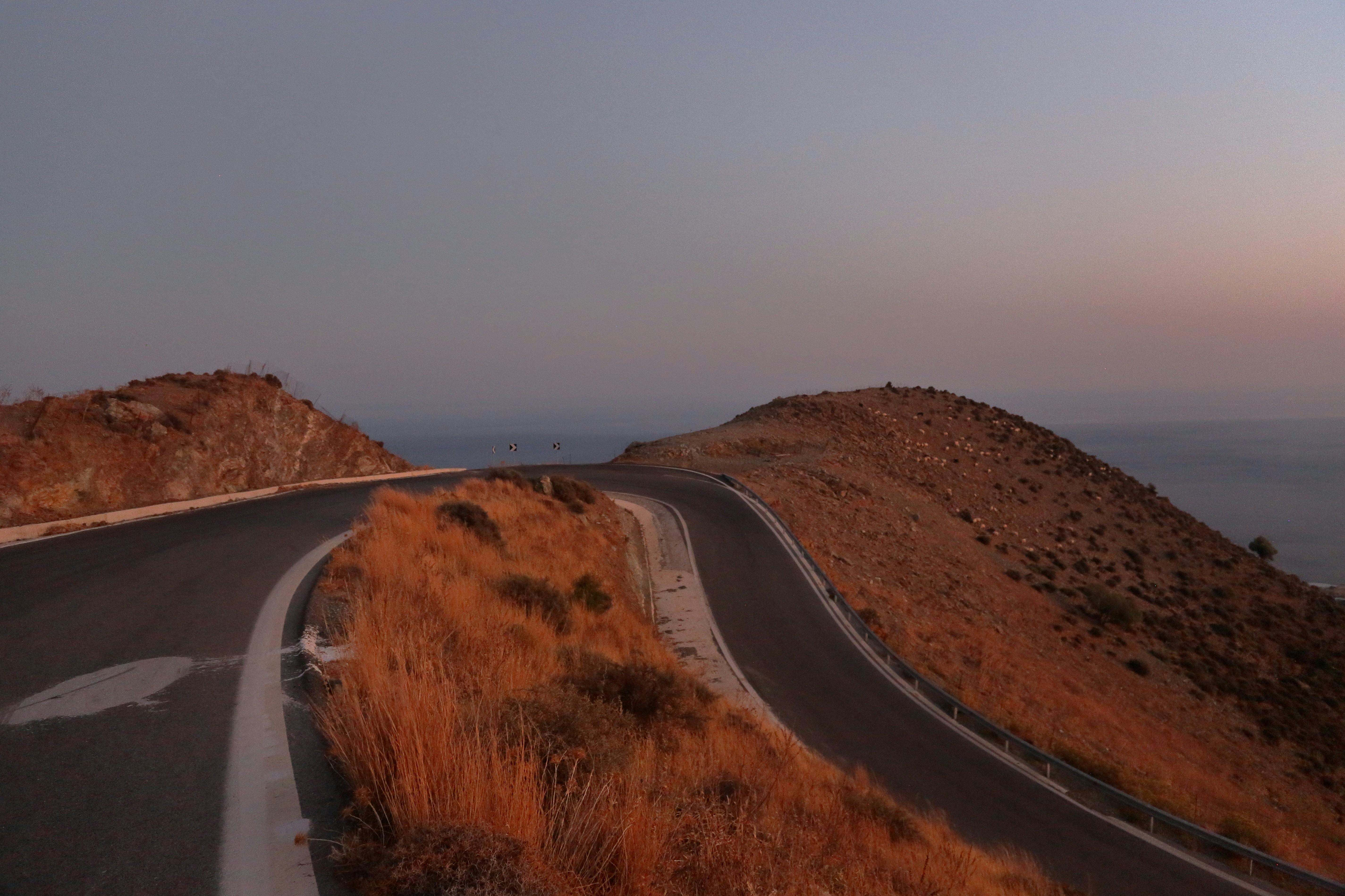 Winding Crest: Sunset Road over Dried Hills