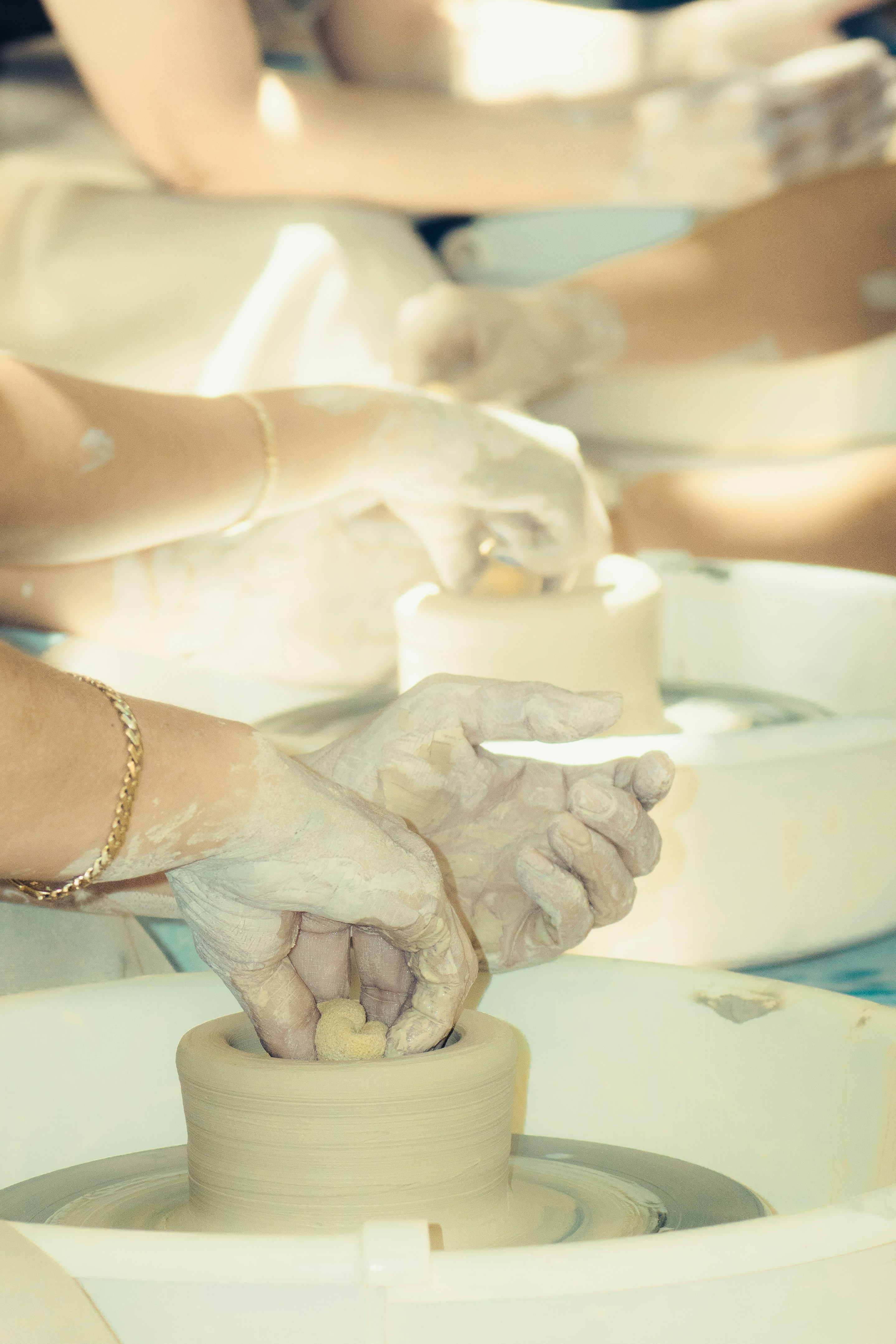 Hands at the Wheel of Clay: Pottery Wheel in Action