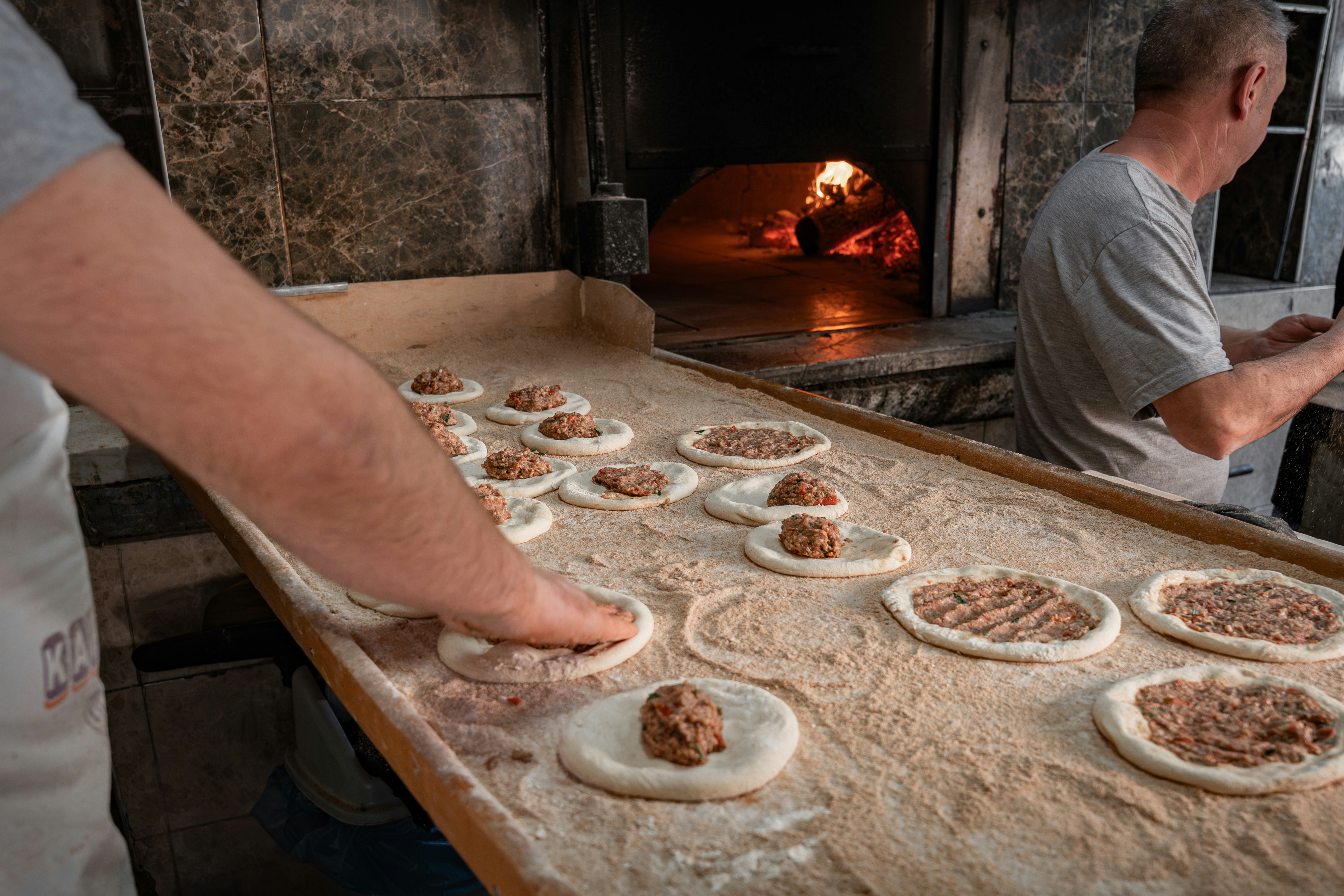 Dough on the Edge: Crafting Mini Pizzas by a Brick-Oven Fire